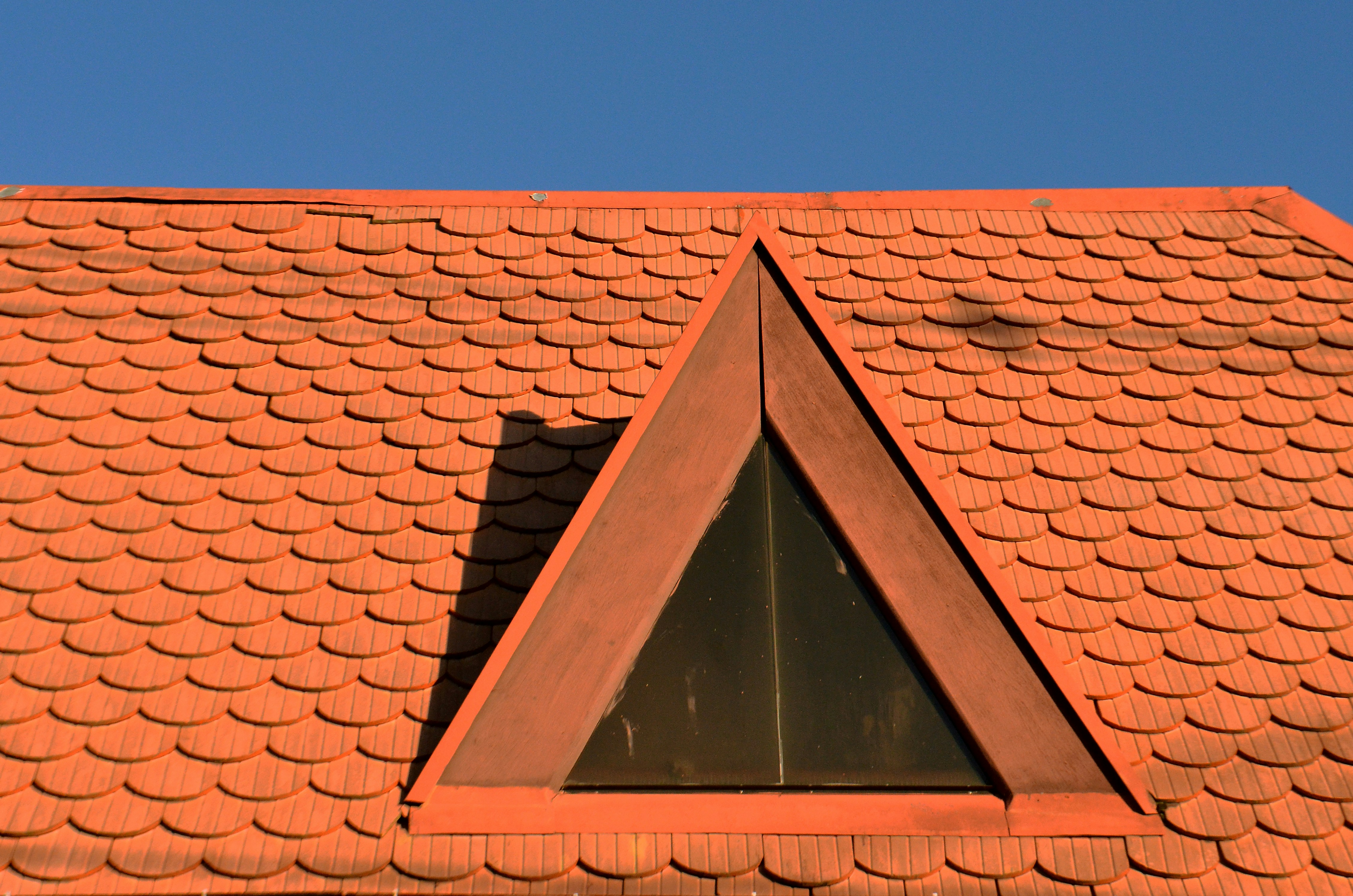 Terracotta Tiles and a Sharp Dormer: Sunlit Geometry