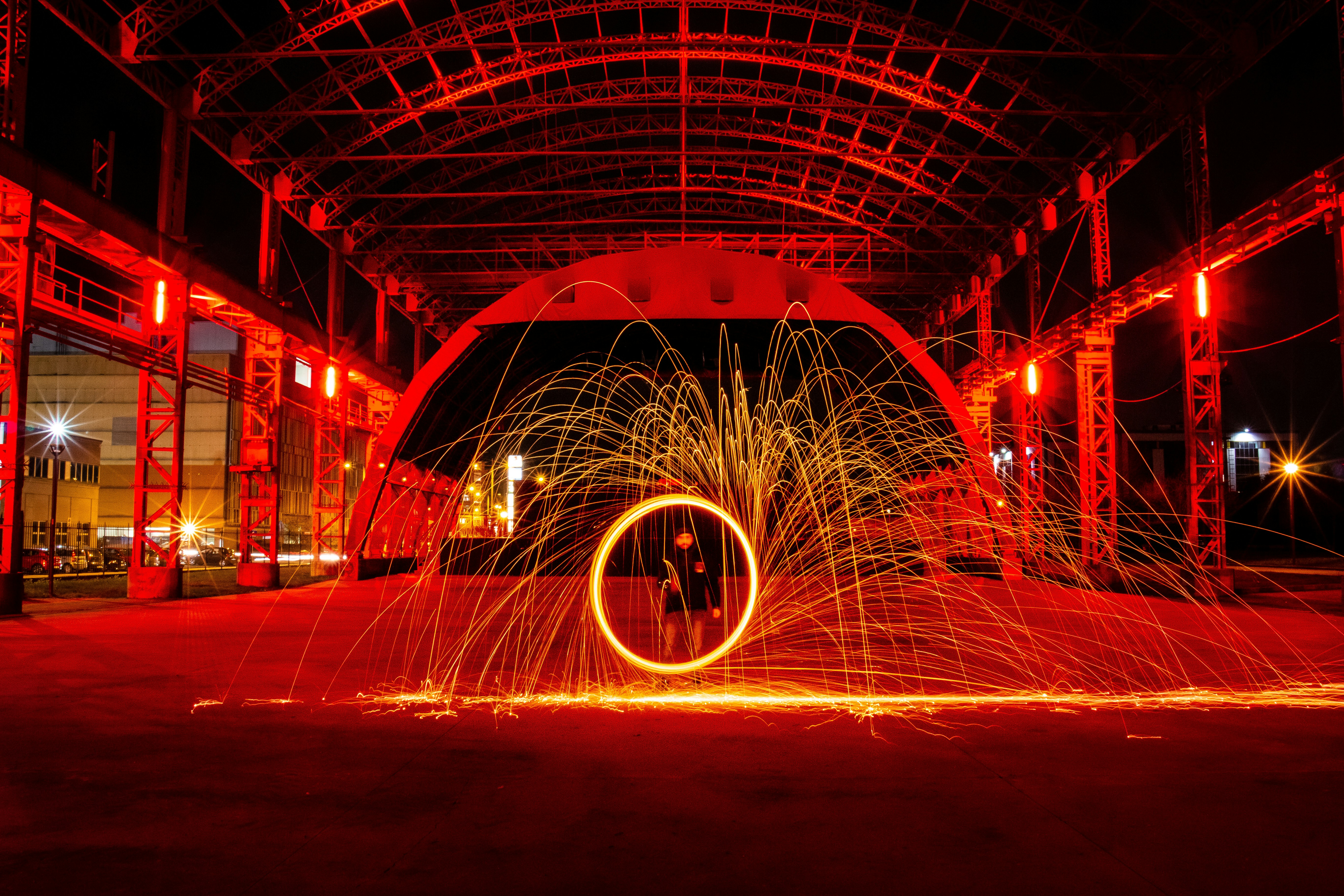 Time lapse photography of person standing in front of fire display ...