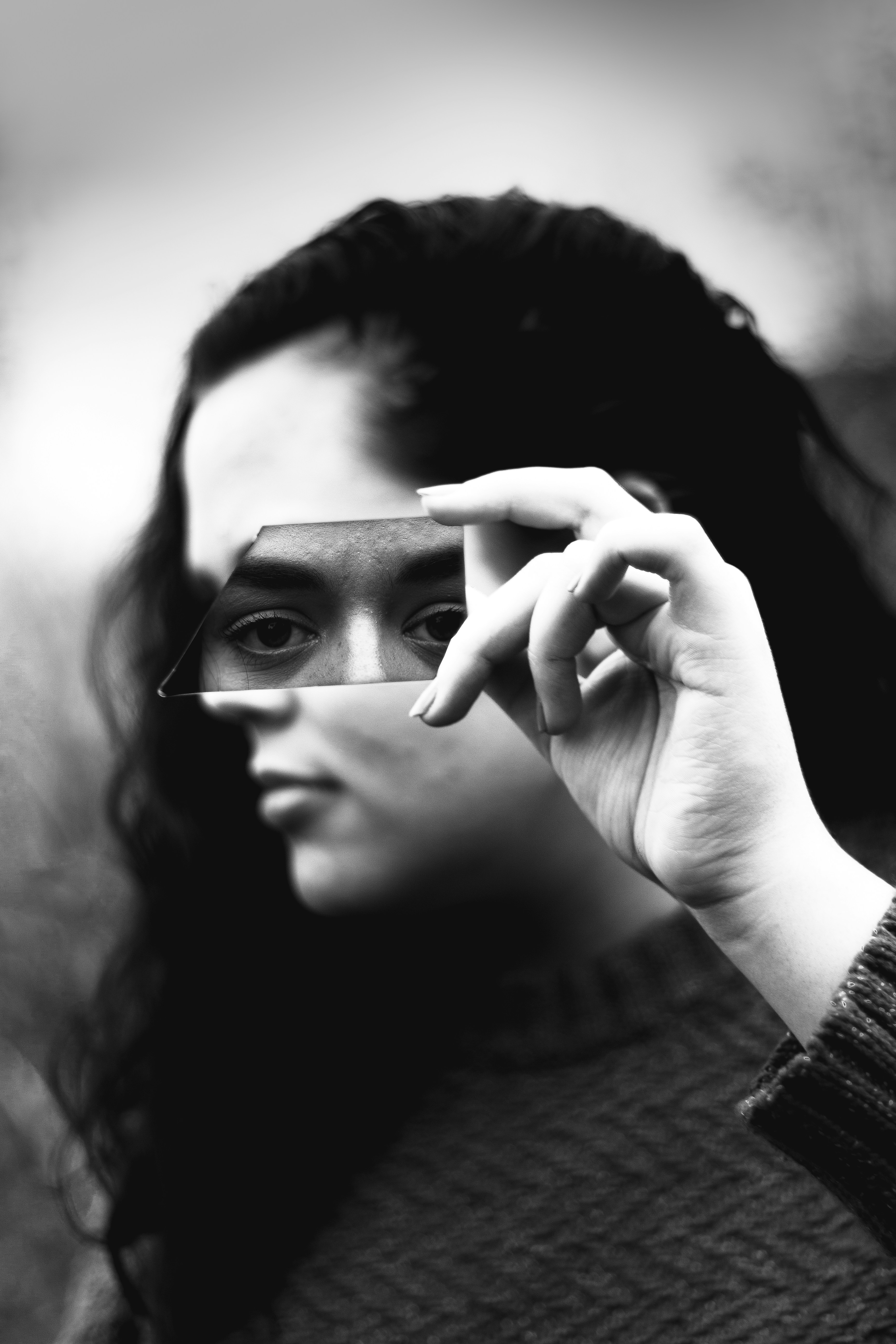 Through a Glass Slice: A Portrait Framed by a Narrow Shard
