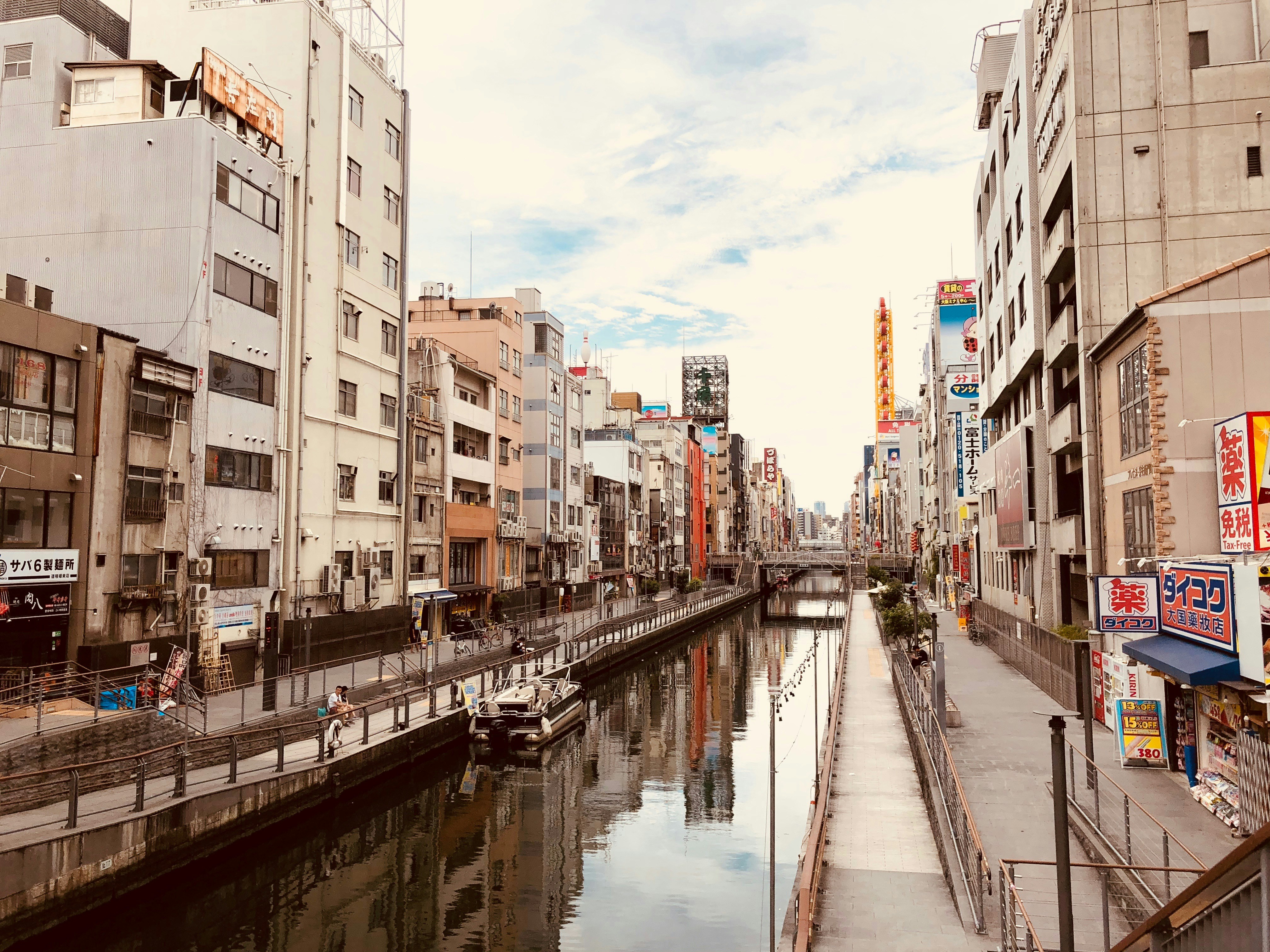 Canal Corridor: Reflections Between Tall City Blocks
