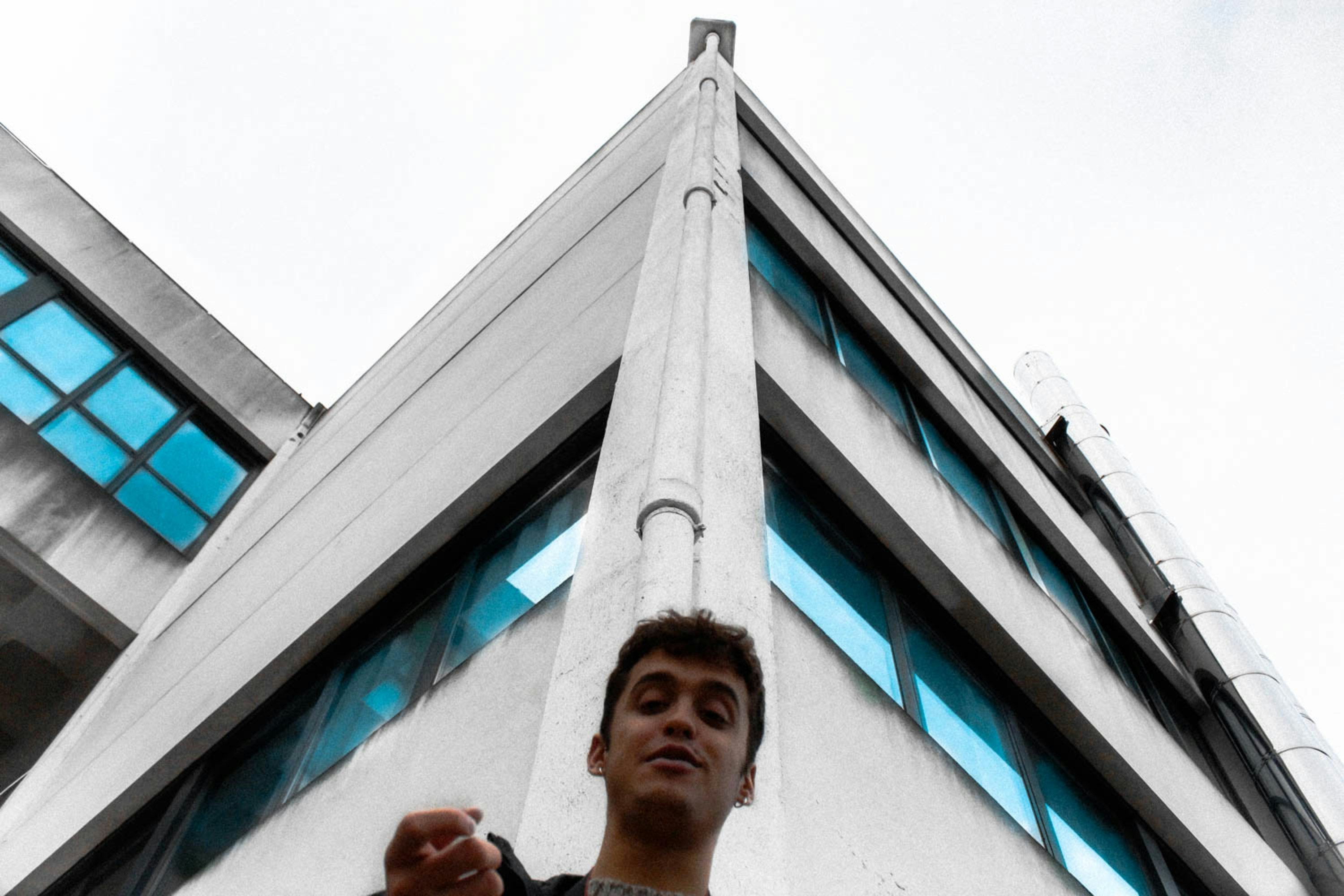 Rising Geometry: A Portrait Beneath a Brutalist Angle