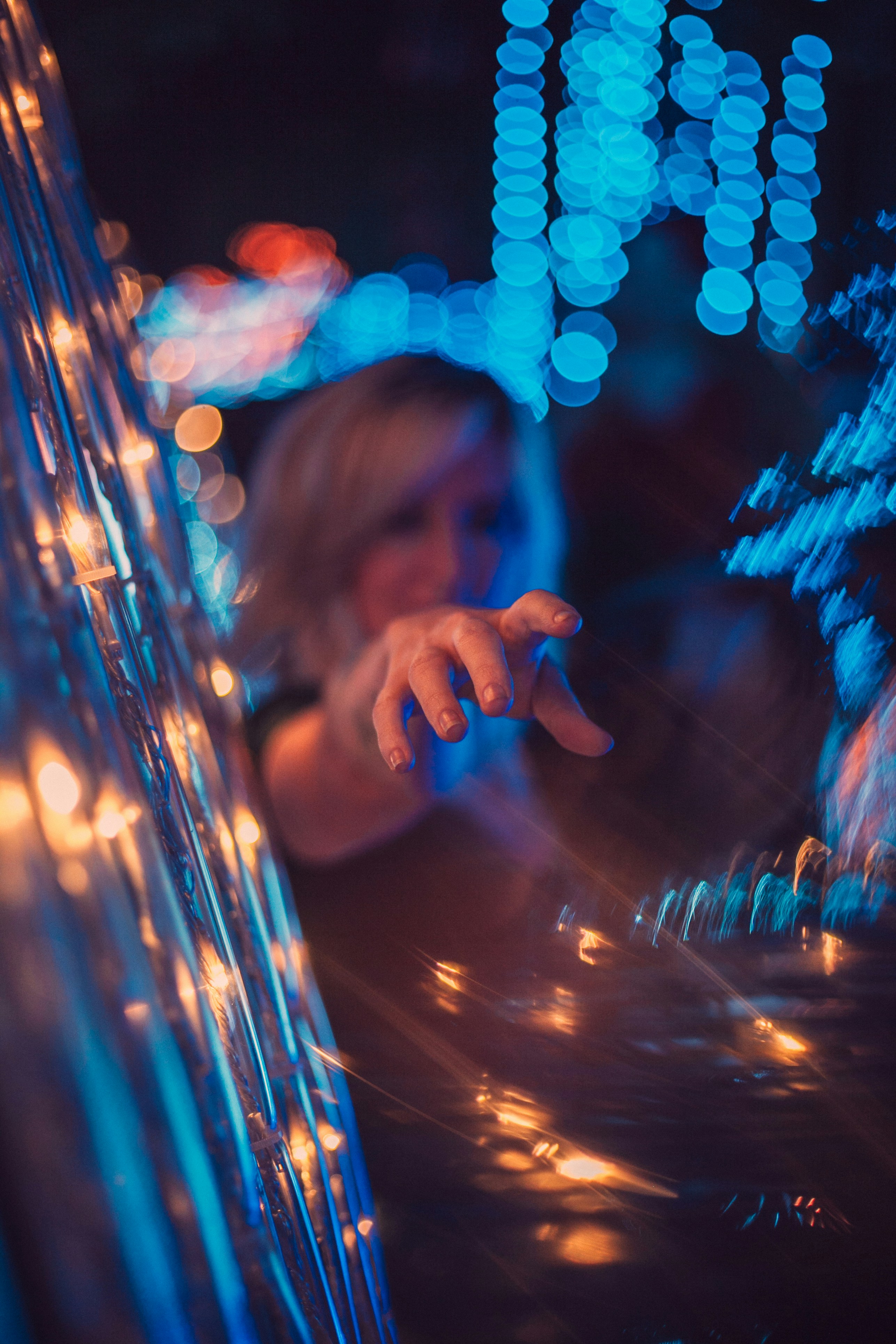 Blue Neon Reach: A Glimpse Through the Glass