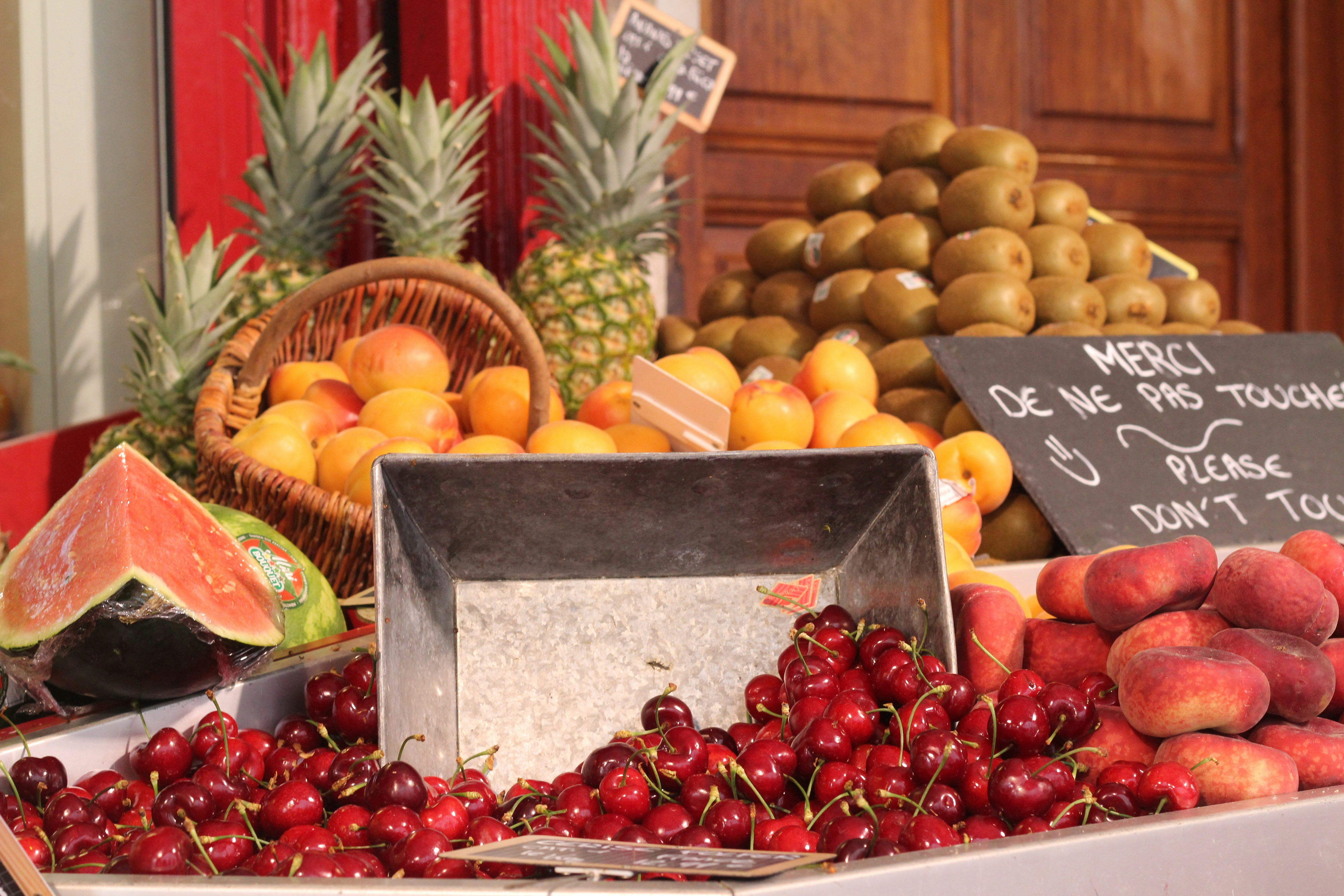 Fruit Market Sketch: Cherries, Watermelon, and Pineapple Display