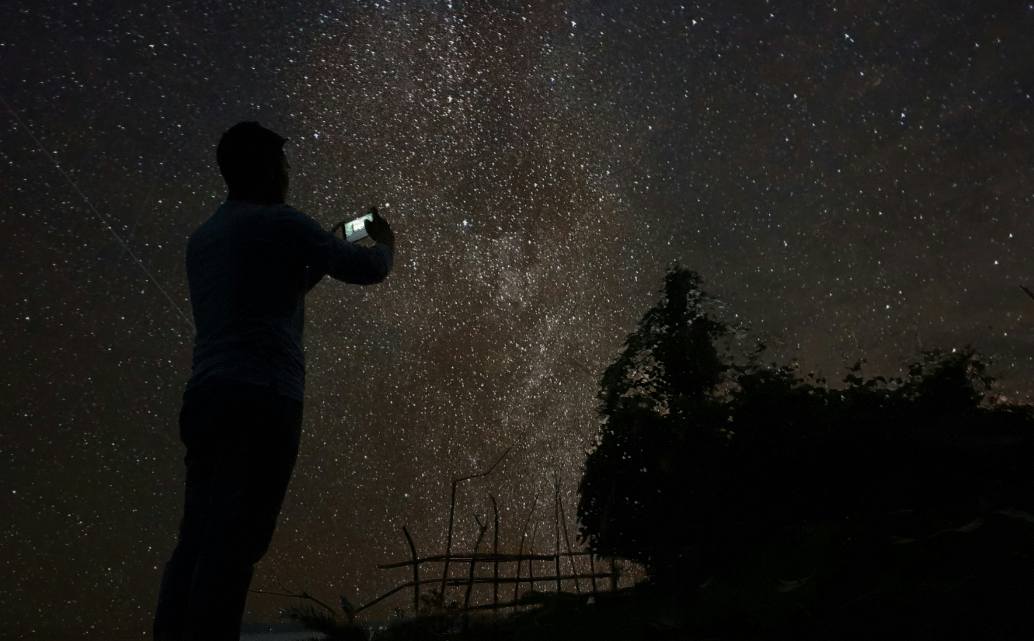 Silhouette Under the Milky Way: A Night Scout on the Quiet Hill