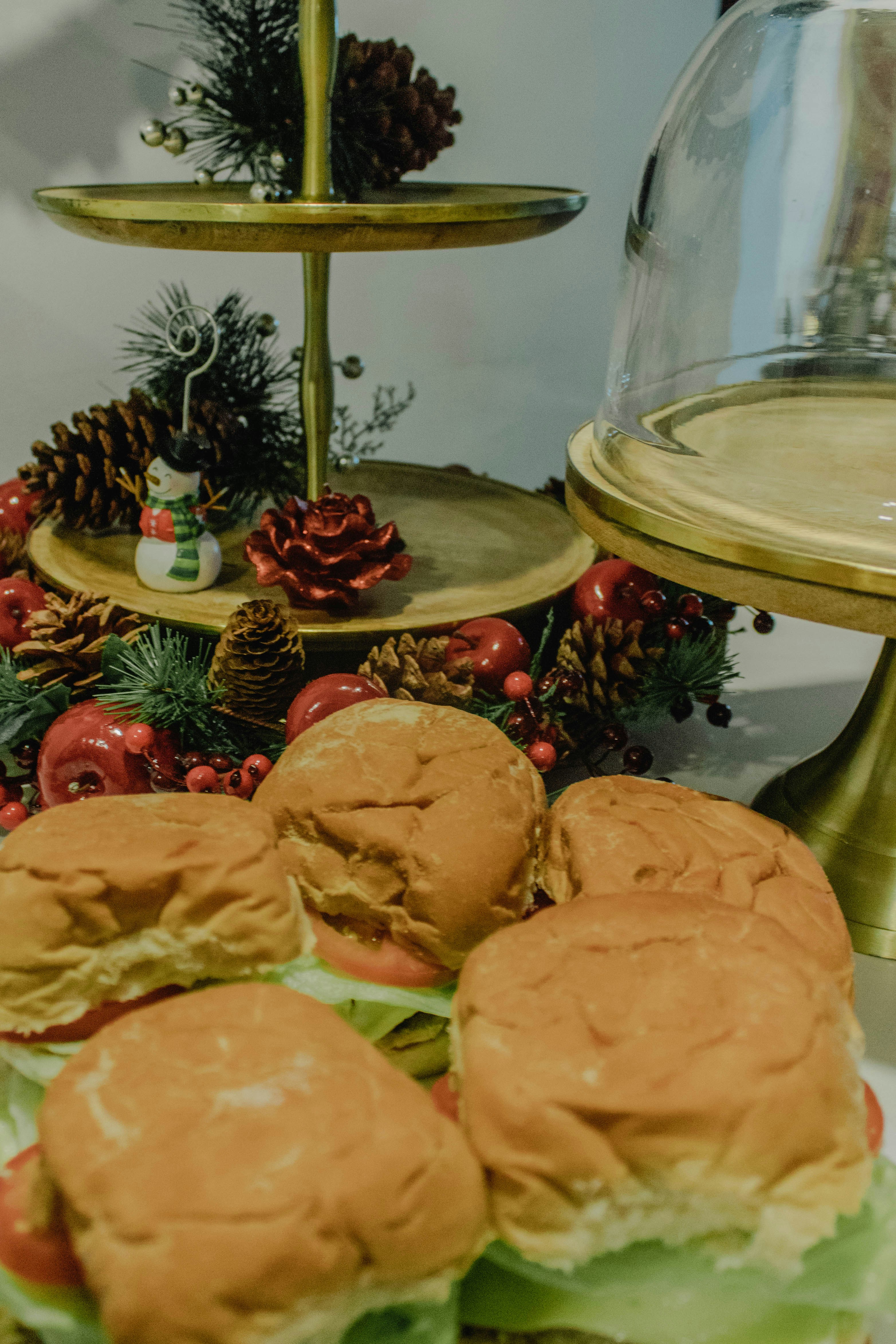 Festive Slider Spread Framed by Pine Cones and Glass Domes