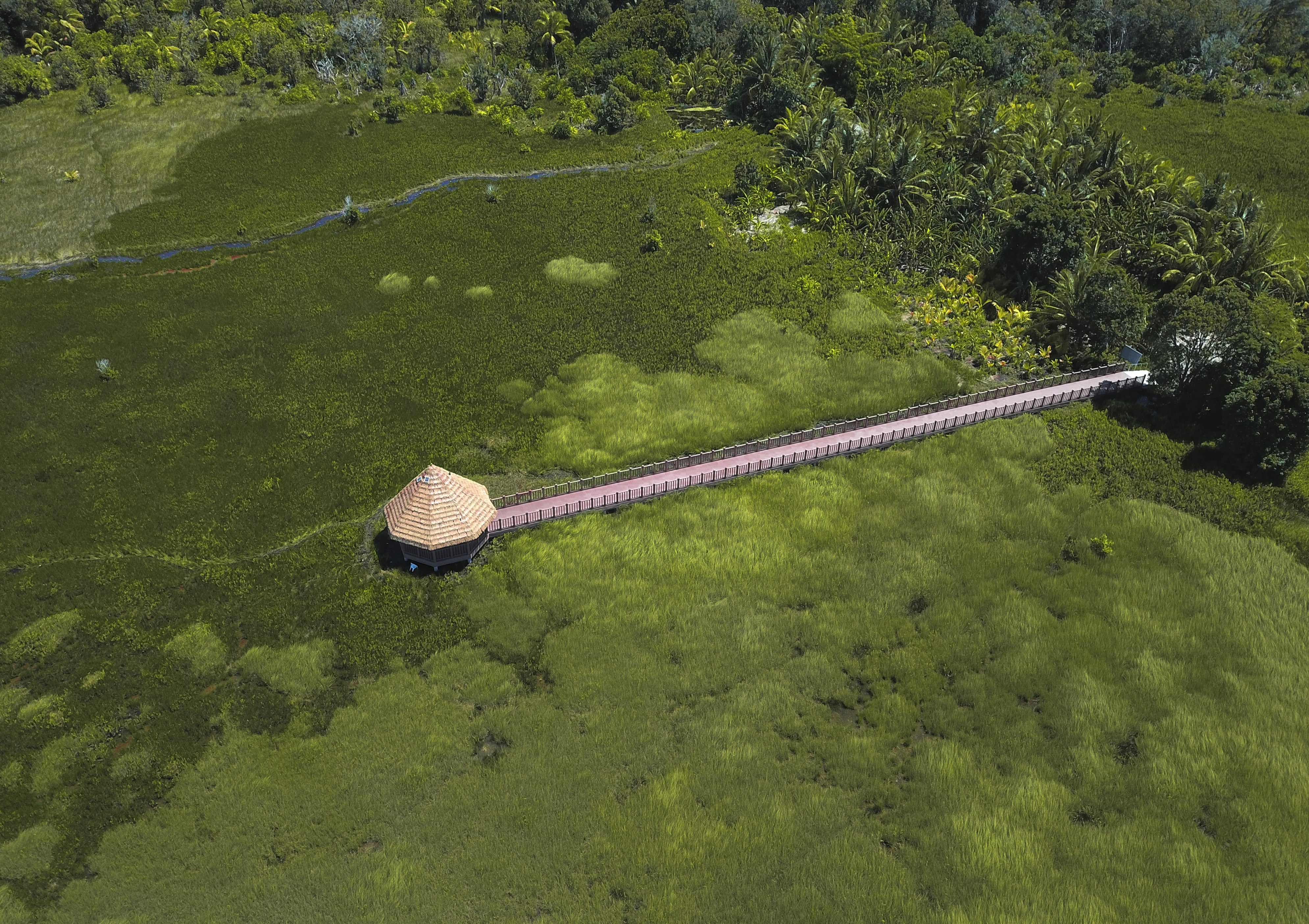 Timber Promenade to a Secluded Gazebo Over Emerald Fields