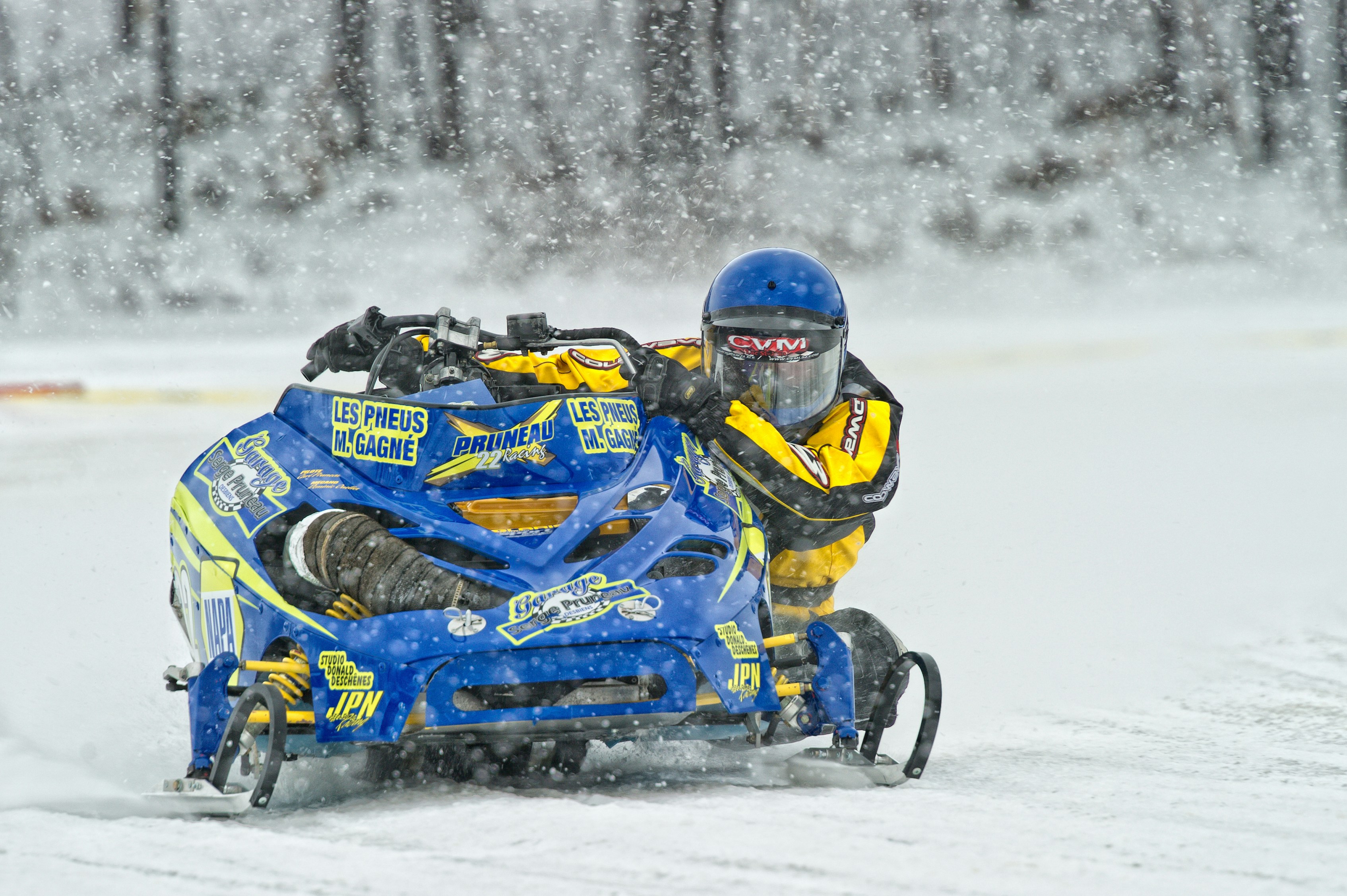 Person riding blue snowmobile on field photo – Free Helmet Image on ...
