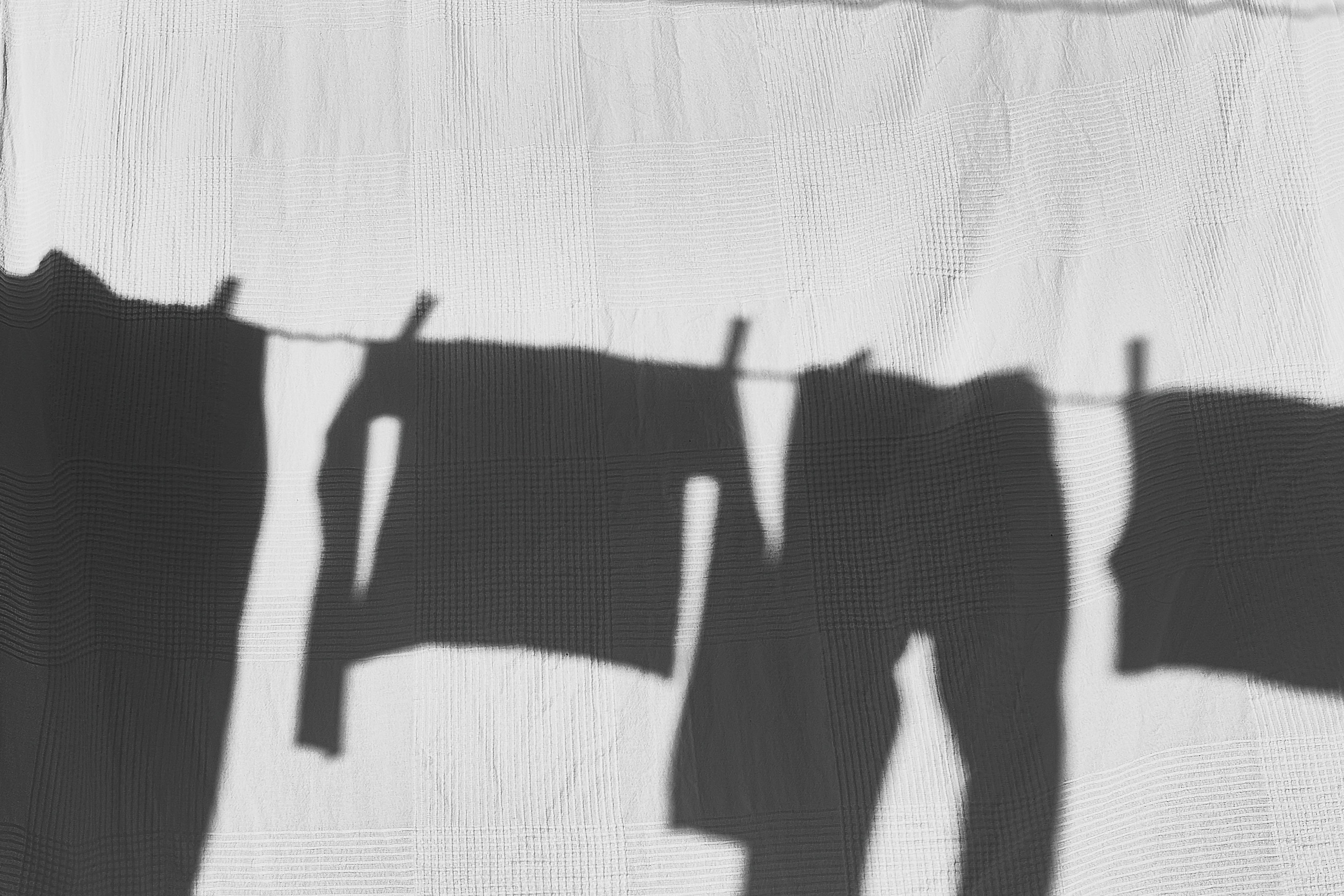 Shadow of four clothes photo – Free Grey Image on Unsplash
