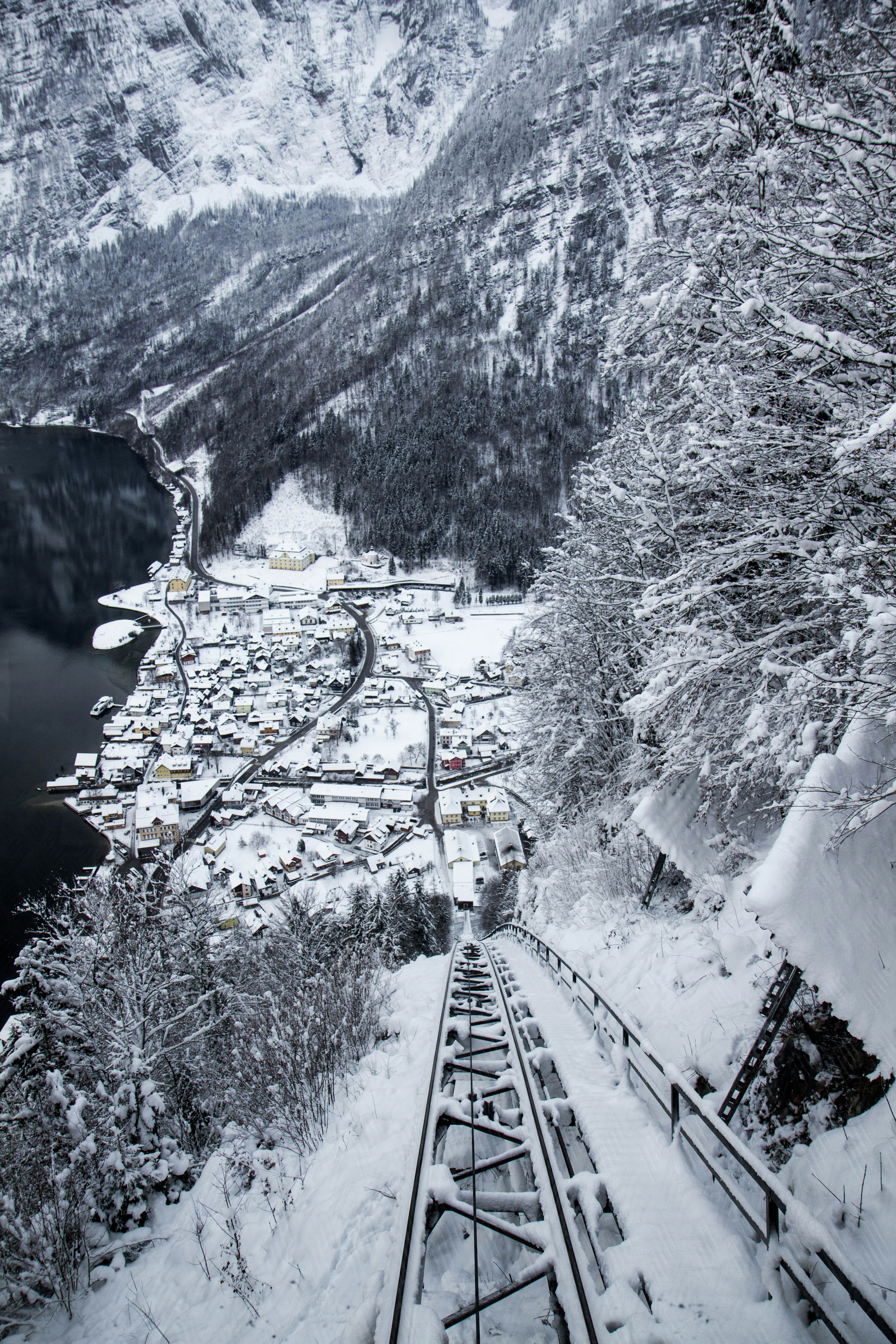 Snowbound Climb: Aerial rails Descend into a Quiet Alpine Village