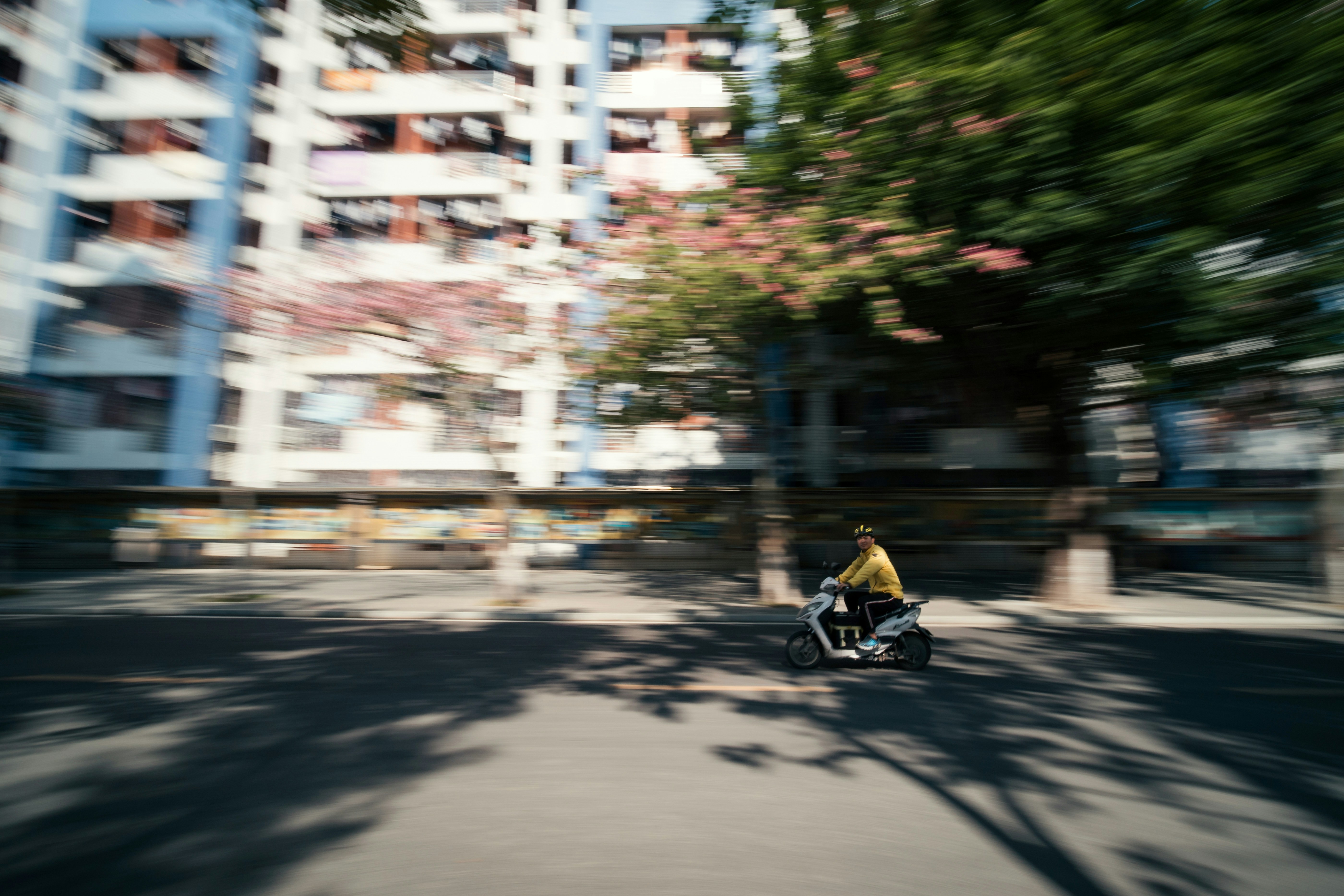 Person riding motor scooter photo – Free Person Image on Unsplash