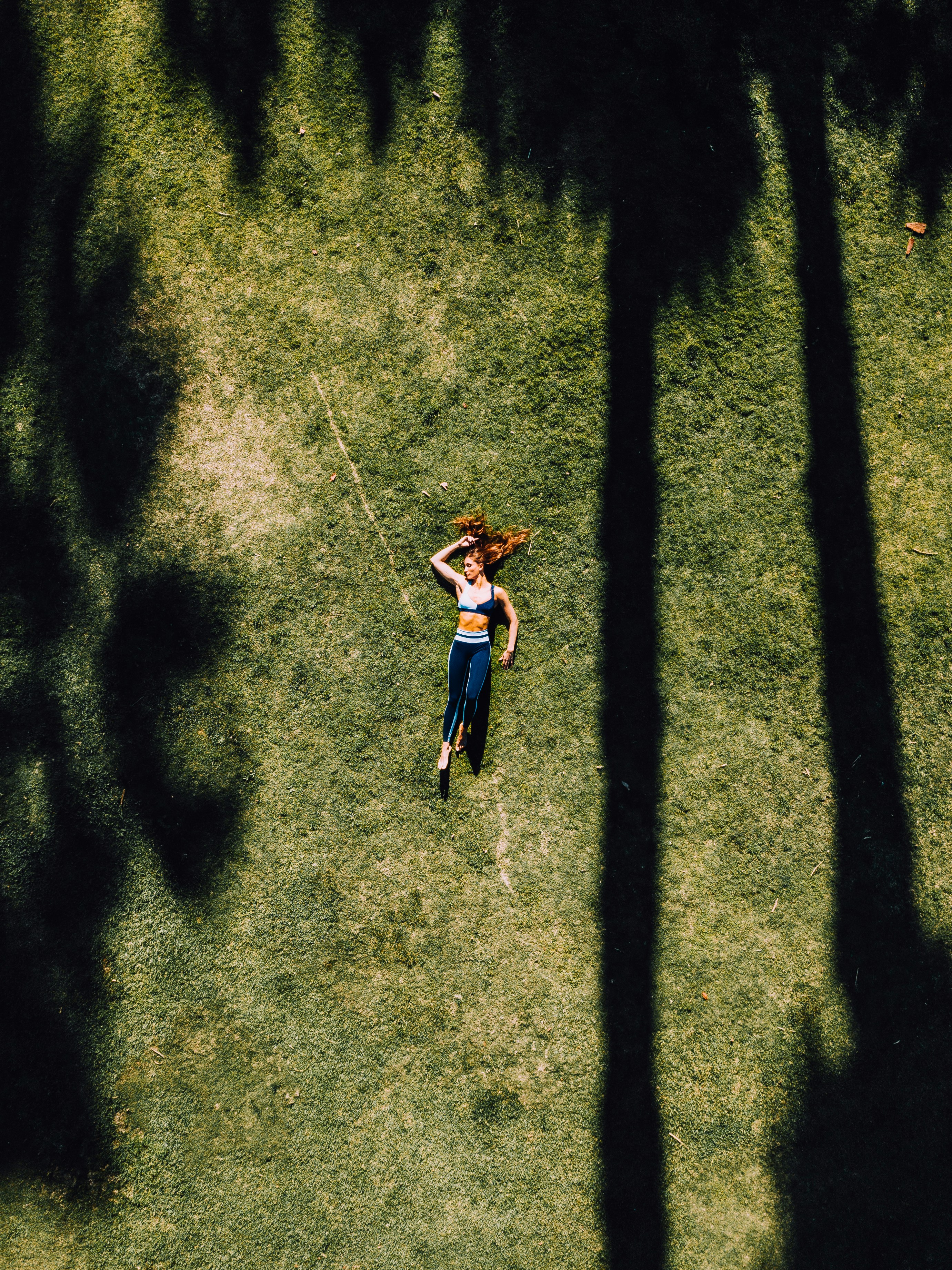 Lounging in Santa Monica | woman lying on green grass during daytime