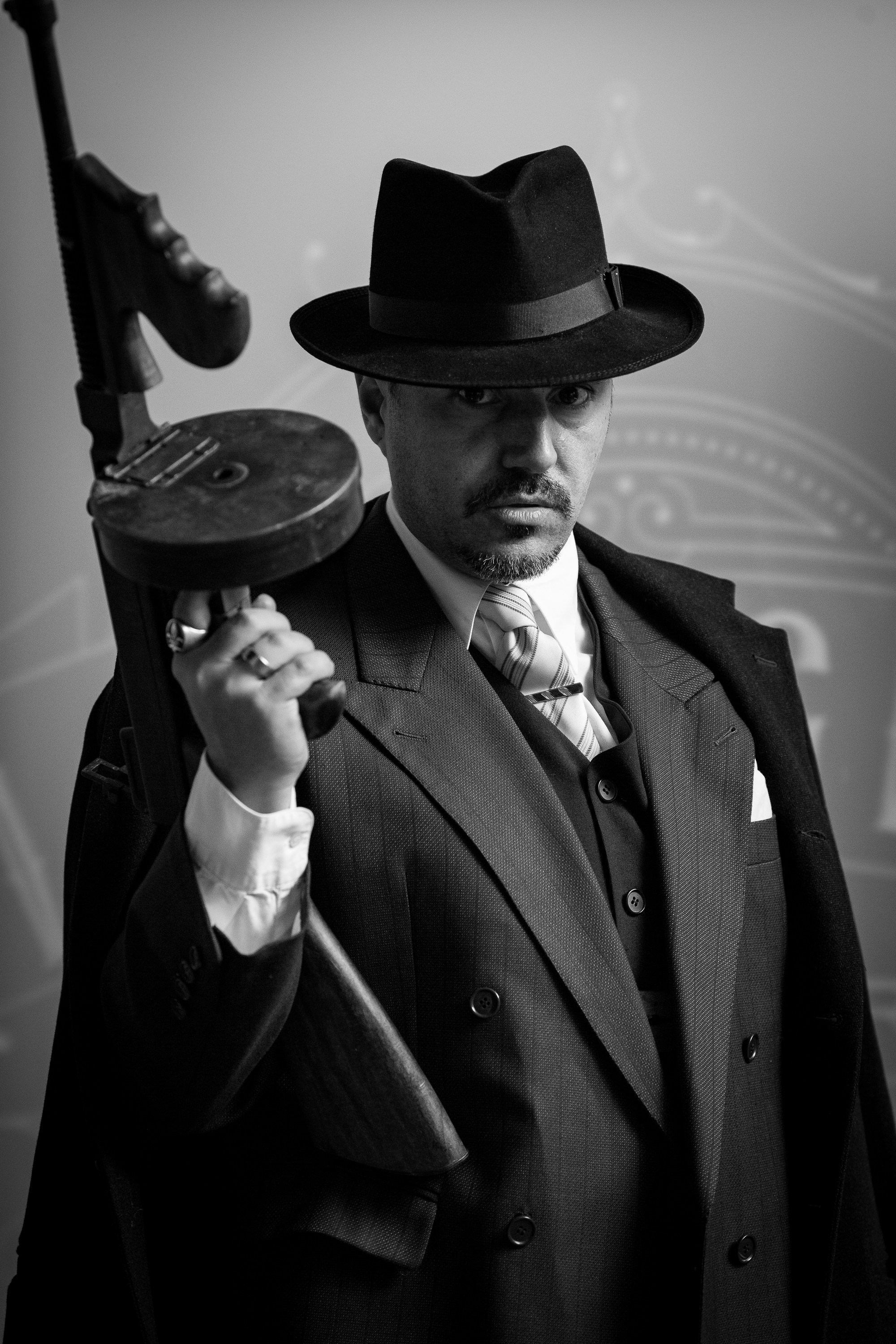 Grayscale photo of person holding tommy gun photo – Free Grey Image on ...