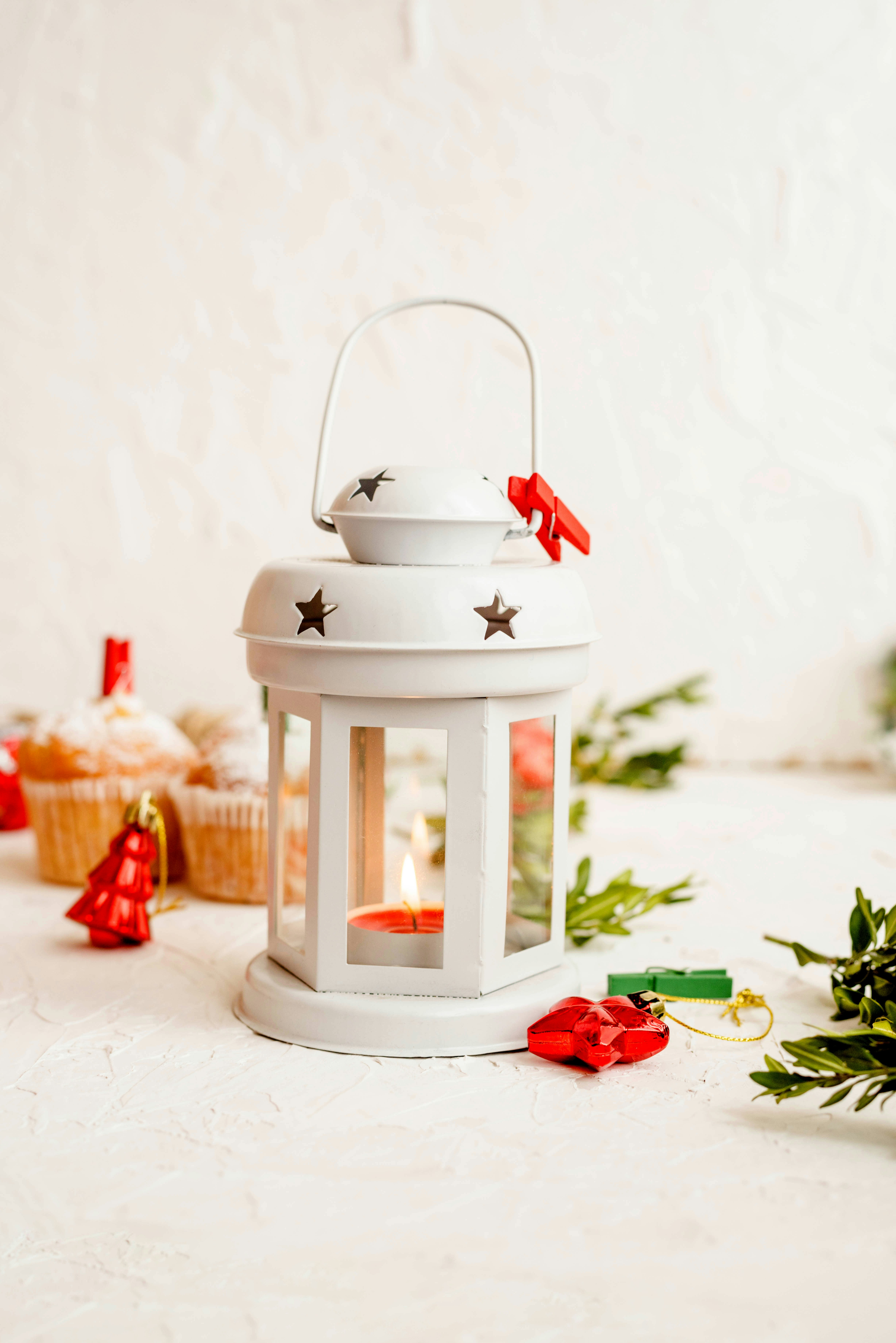 White star lantern and candle centerpiece with holiday accents