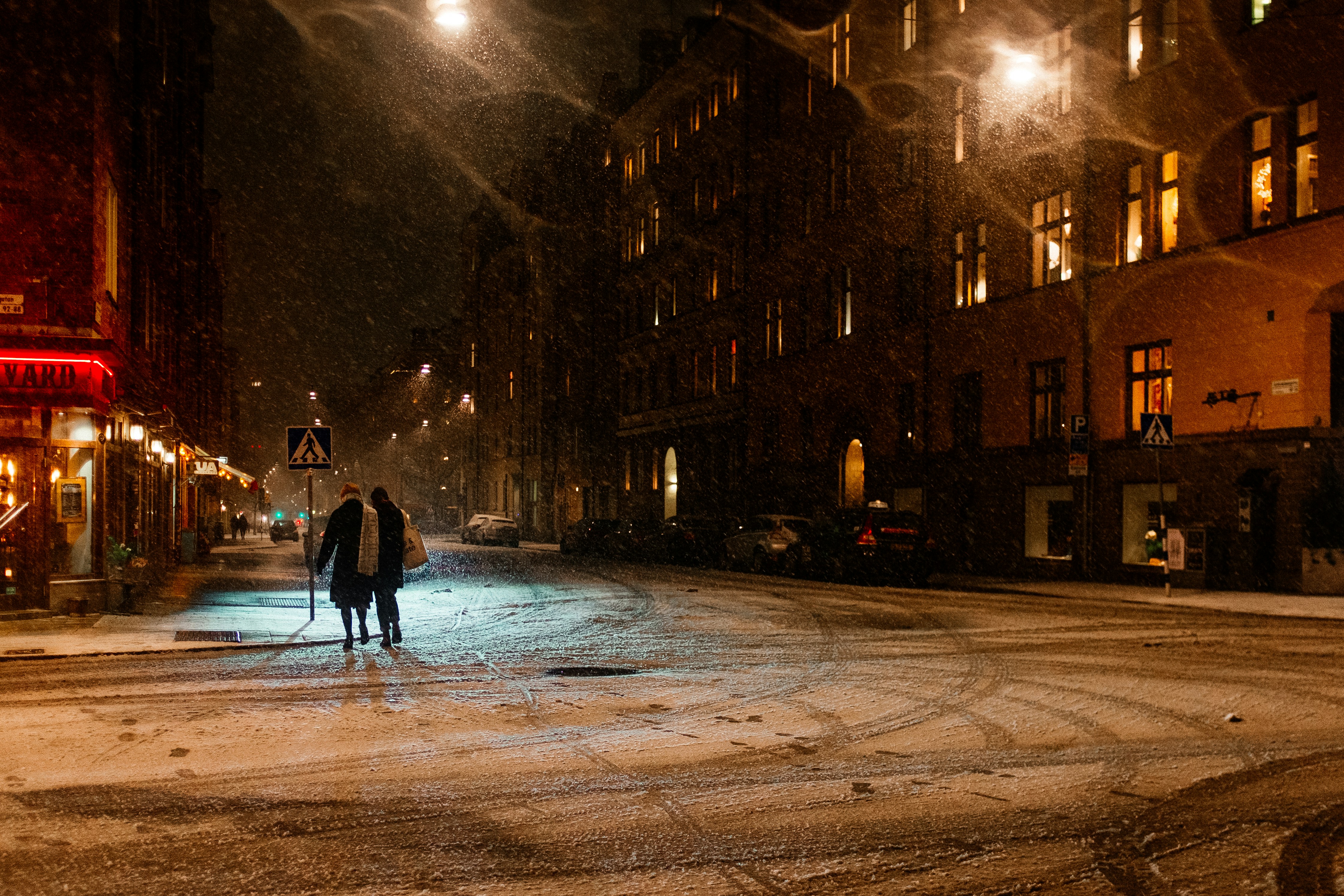 Two person walking on street at night photo – Free City Image on Unsplash