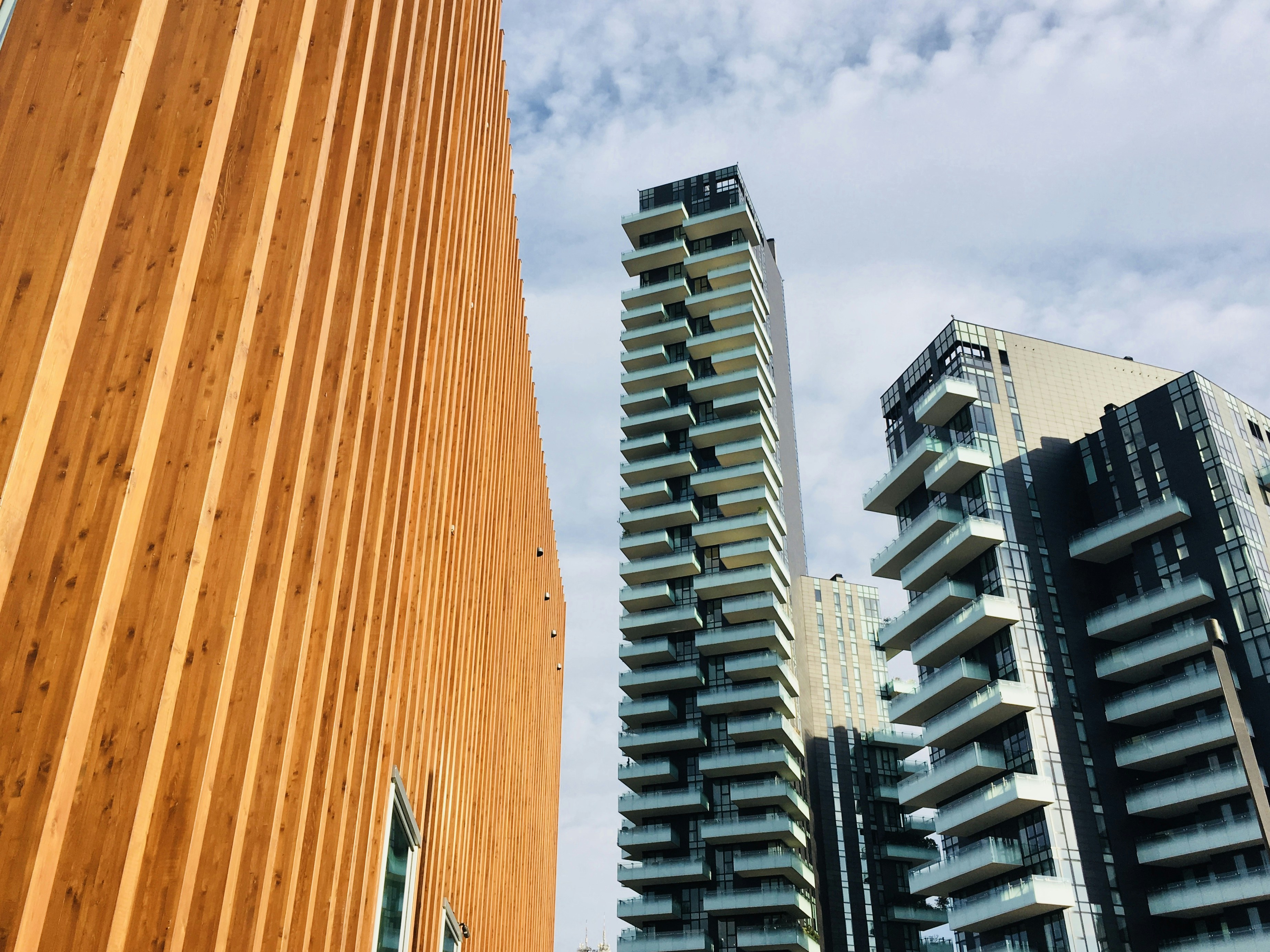 Vertical City: Towers Rising Against a Terracotta Wall