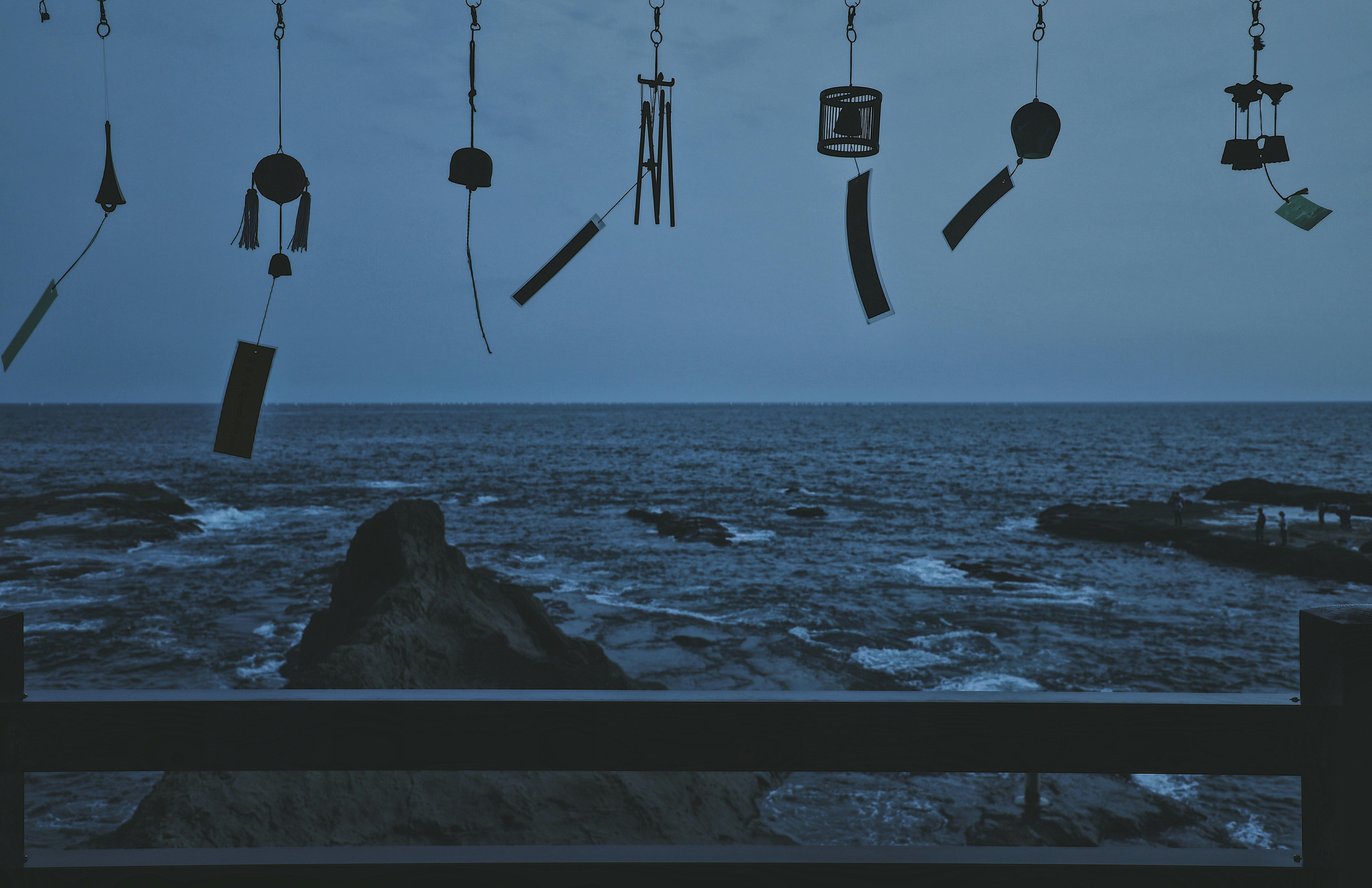 Horizon, Chimes, and Quiet Rails: A Blue Hour Seascape