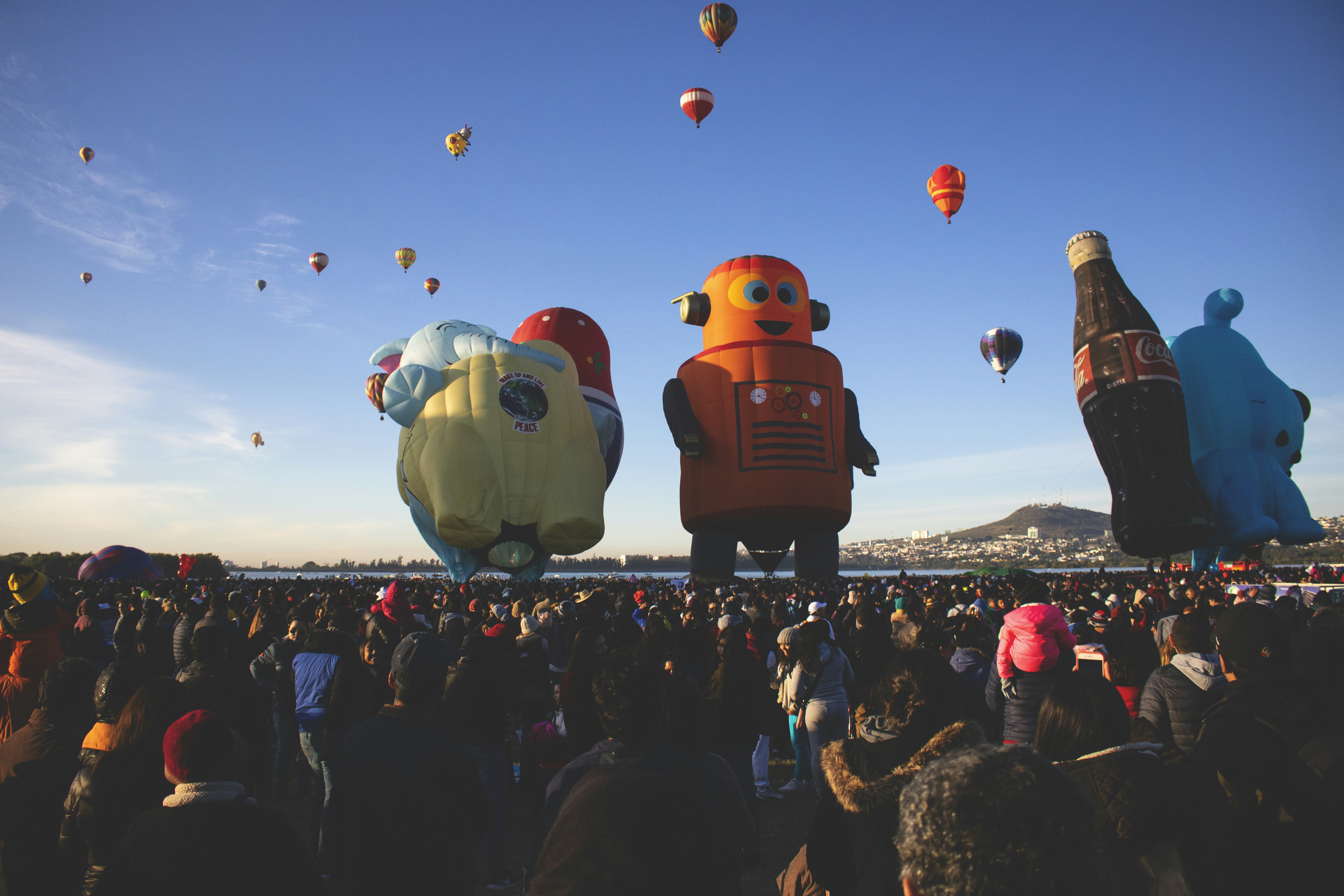 Giant Robotic Balloons Rise Over a Crowded Dawn Festival