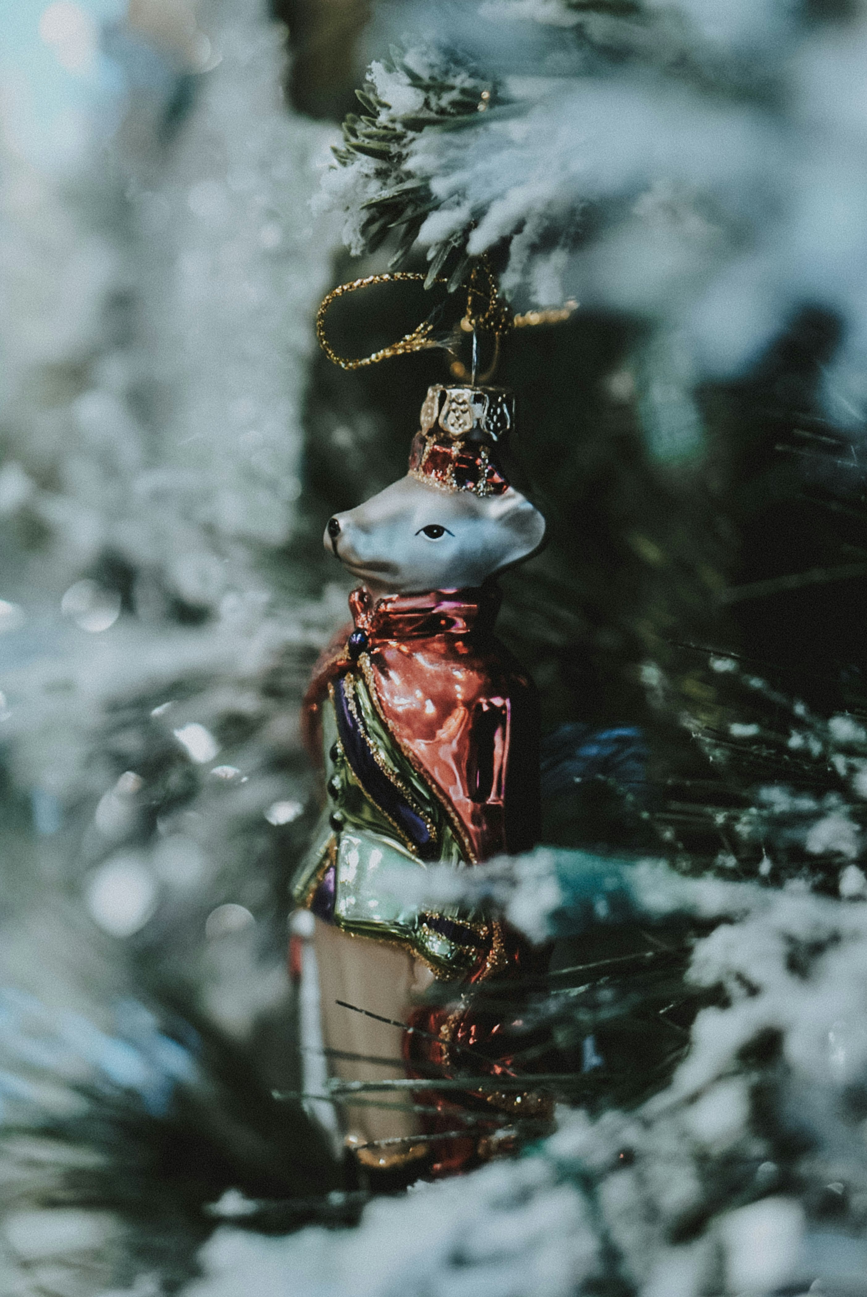Velvet-Dressed Dog Ornament on a Frosted Christmas Tree