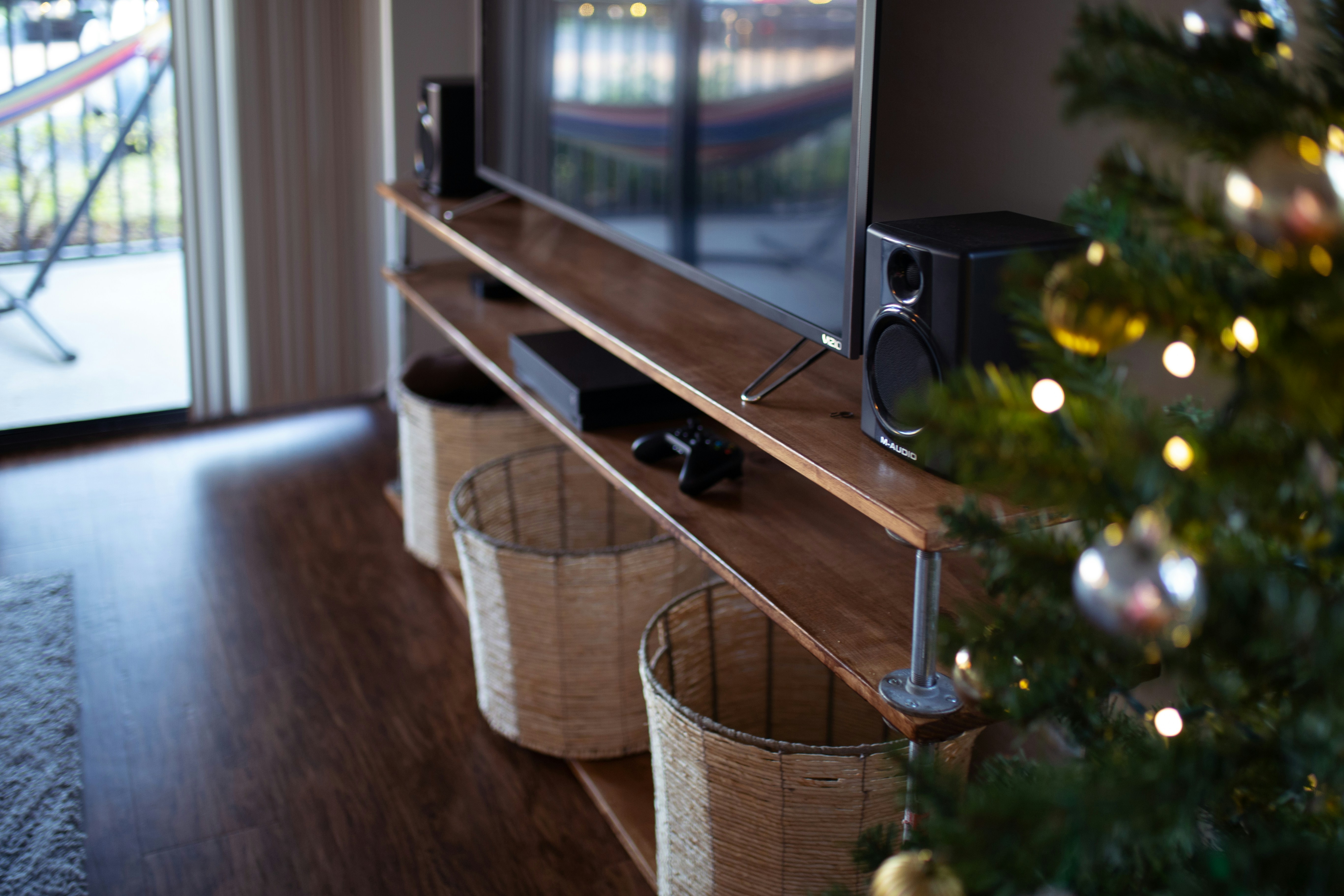 Muted Christmas Glow Framing a Minimal Media Console