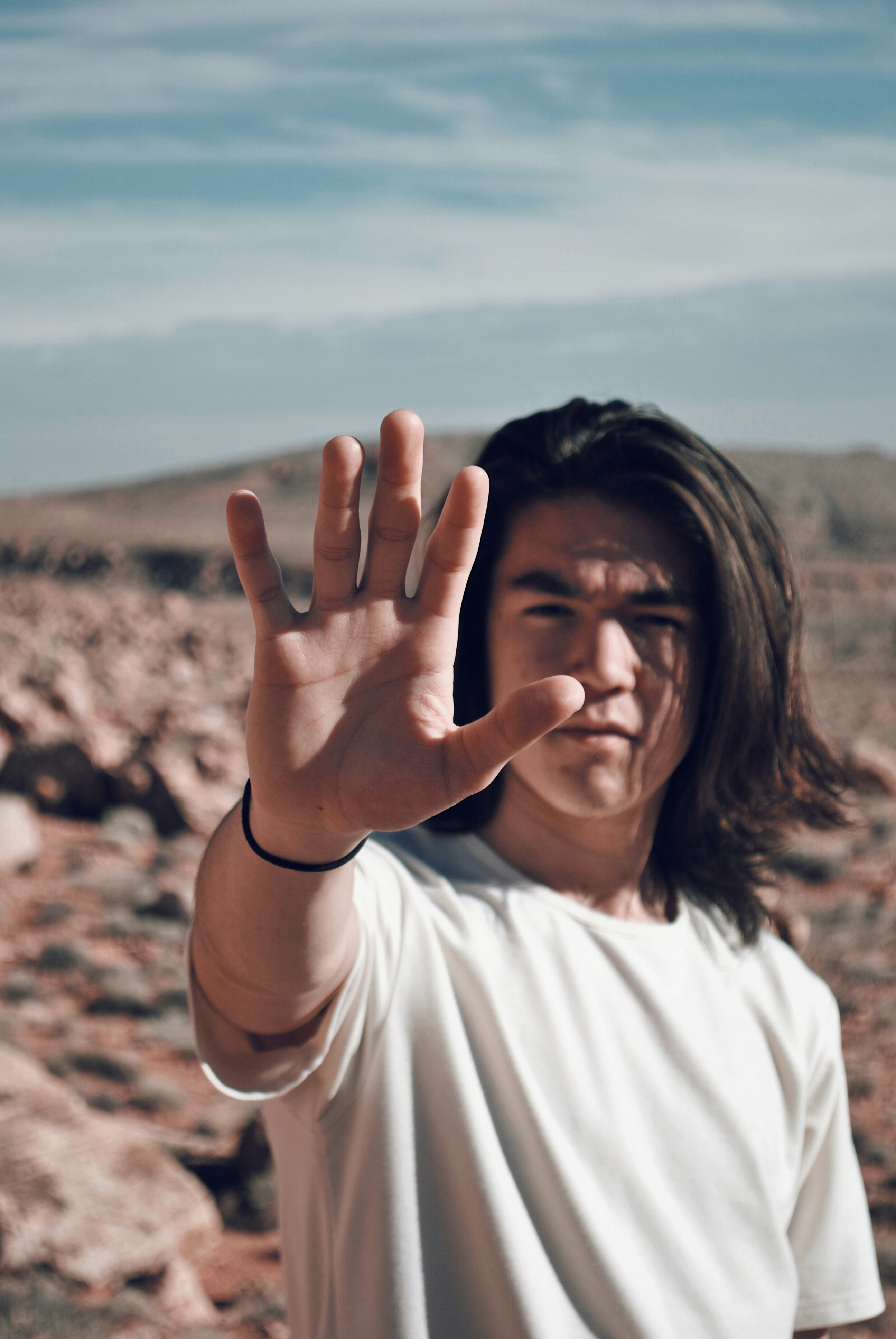 Raised Hand, Open Horizon: A Portrait in Focus and Friction