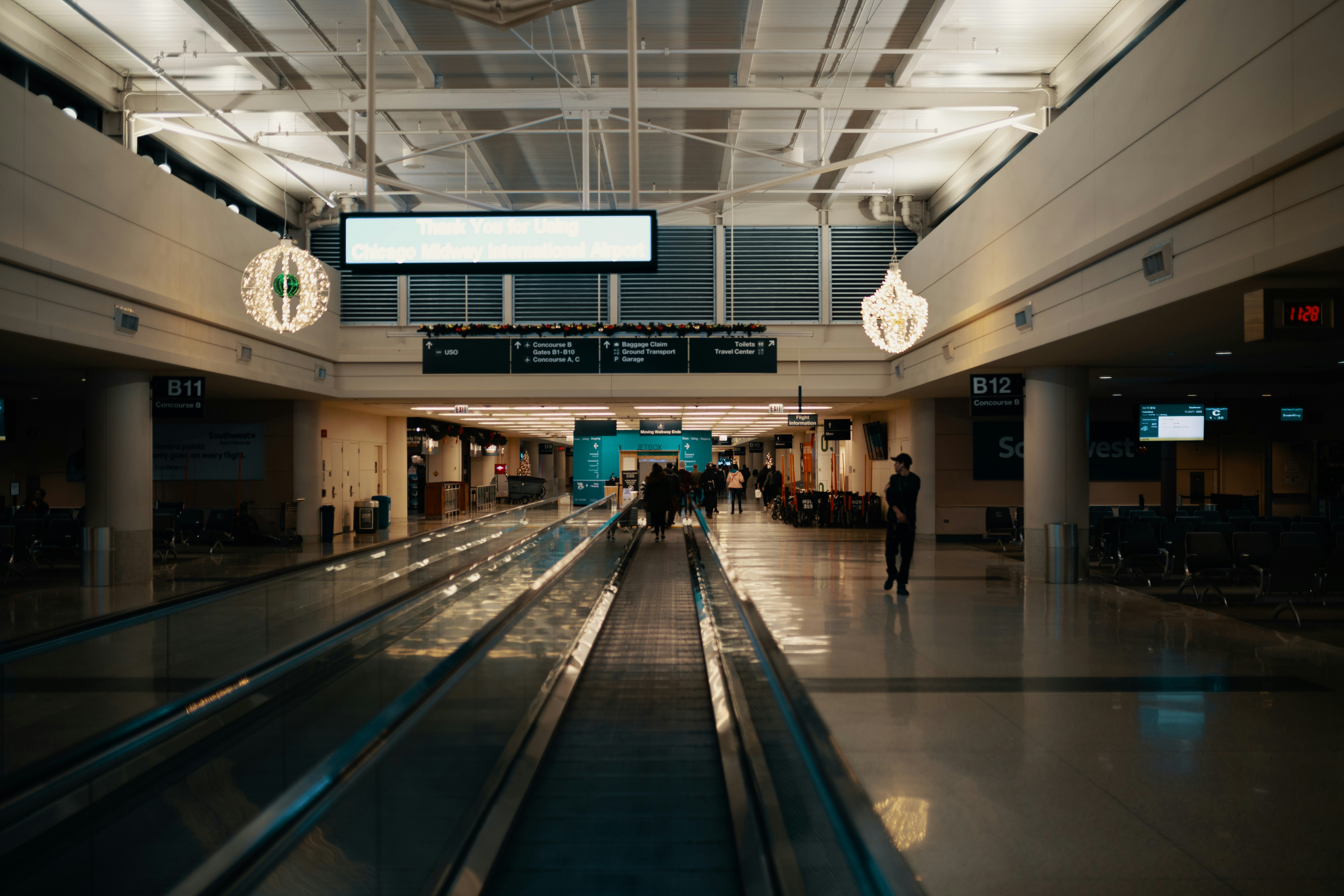 Man walking inside the building photo – Free Airport Image on Unsplash