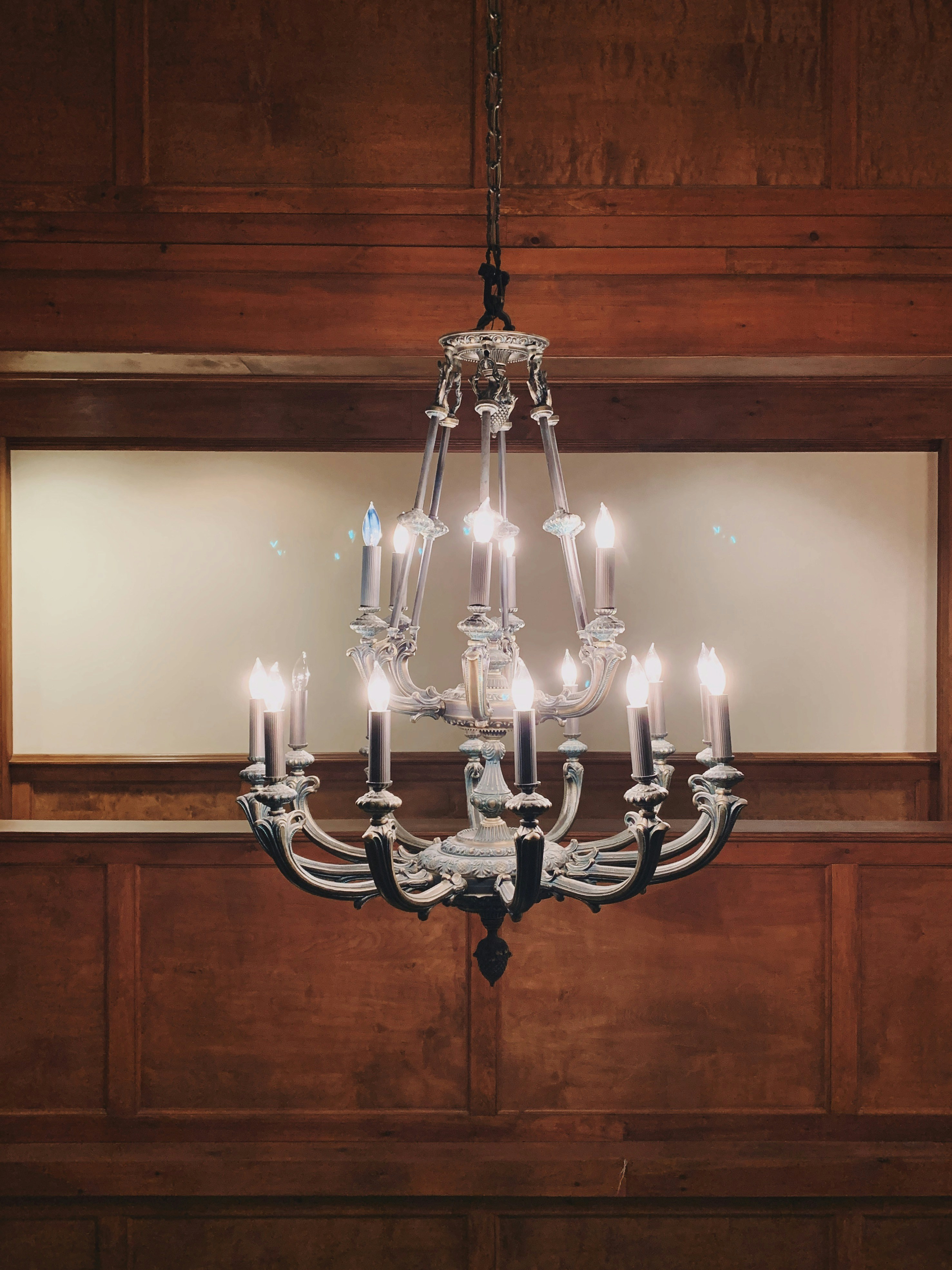 Chandelier Glow in a Wooden Hall