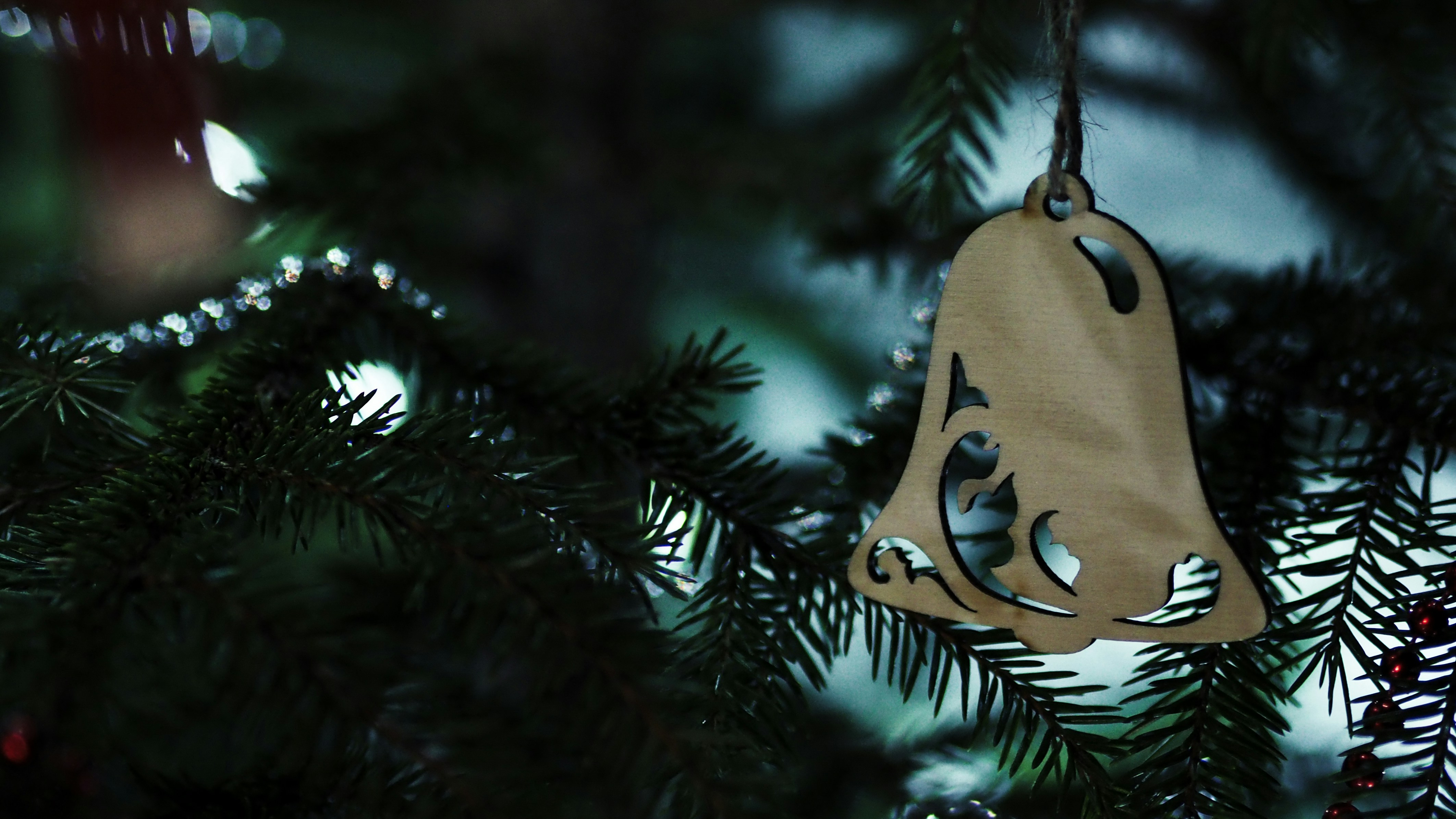 Beige Bell Pendant Dangles Among Moonlit Fir Needles