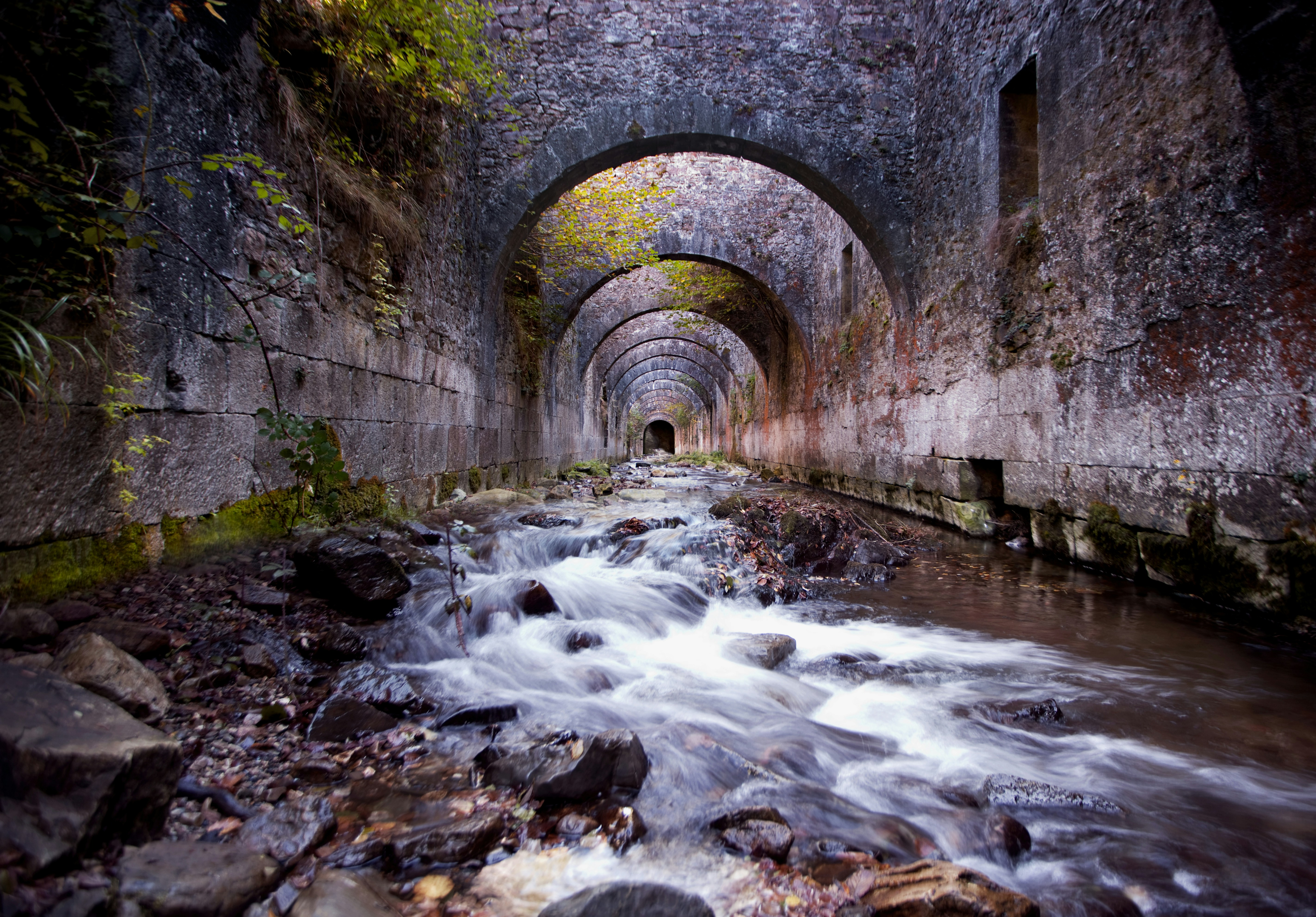 Time lapse photography of water flowing on tunnel during daytime photo ...