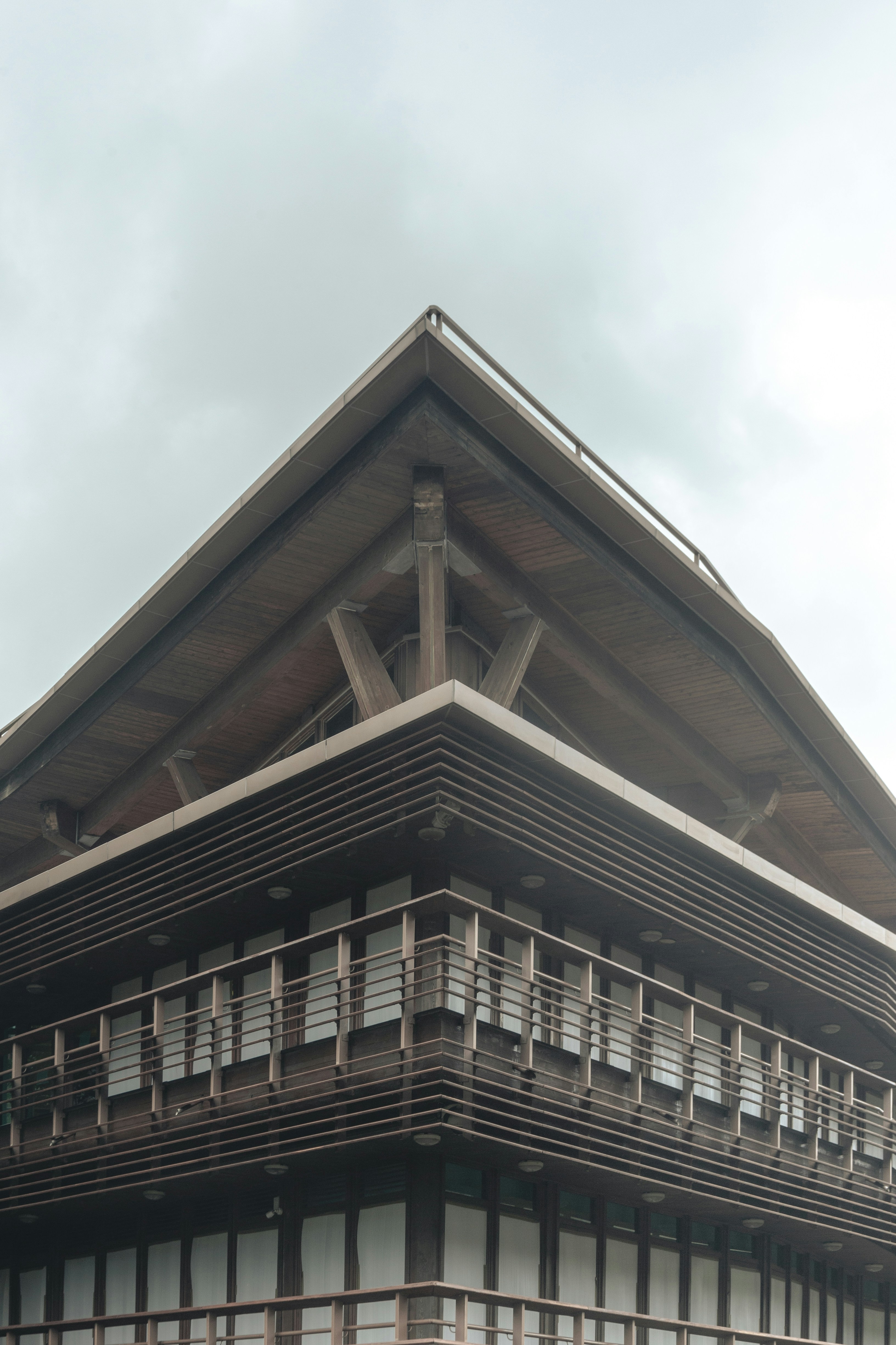 Gabled Timber Tiers: A Corner View of a Layered Pavilion
