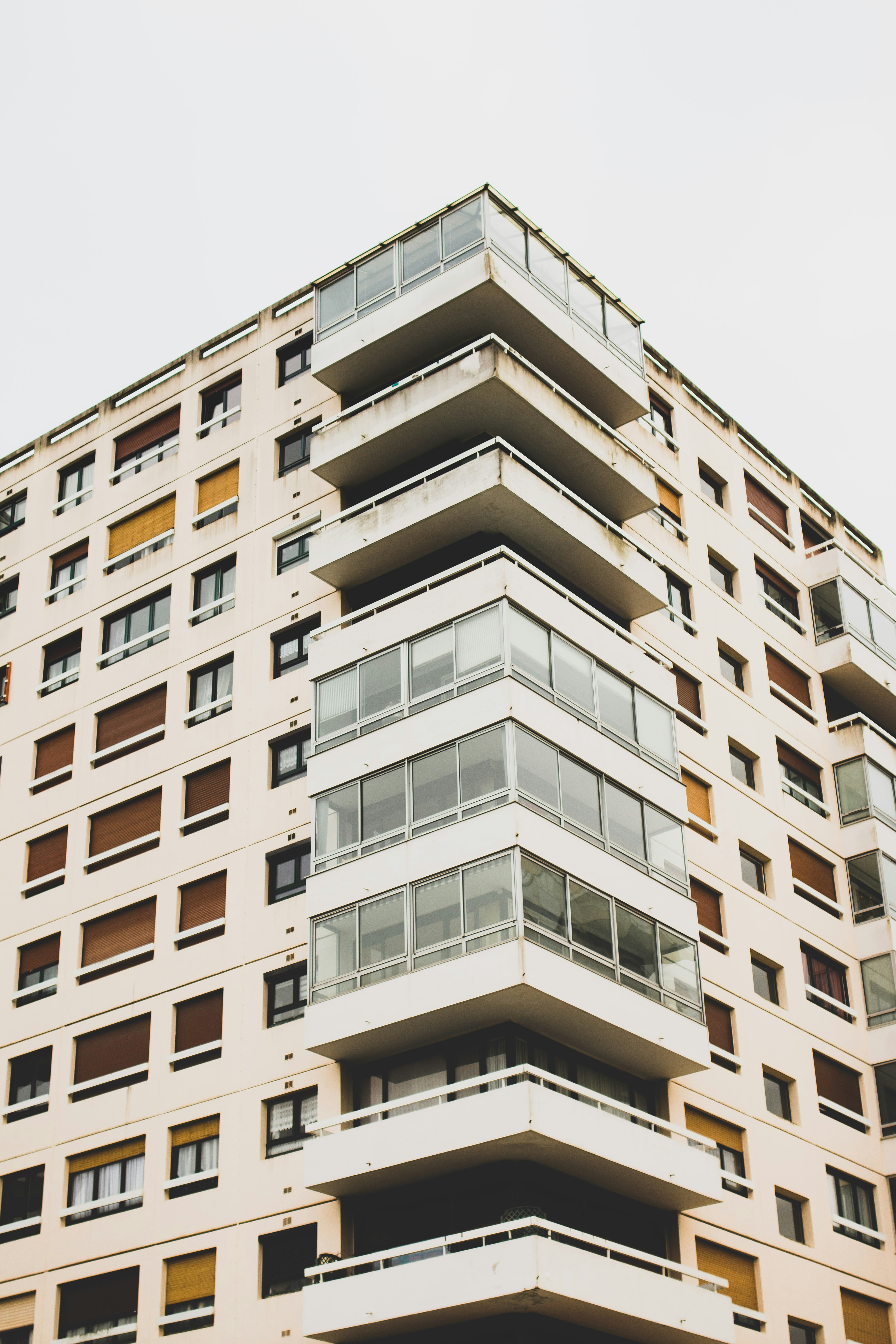 Close-up view of a modern apartment building showcasing its layered balconies and geometric patterns.