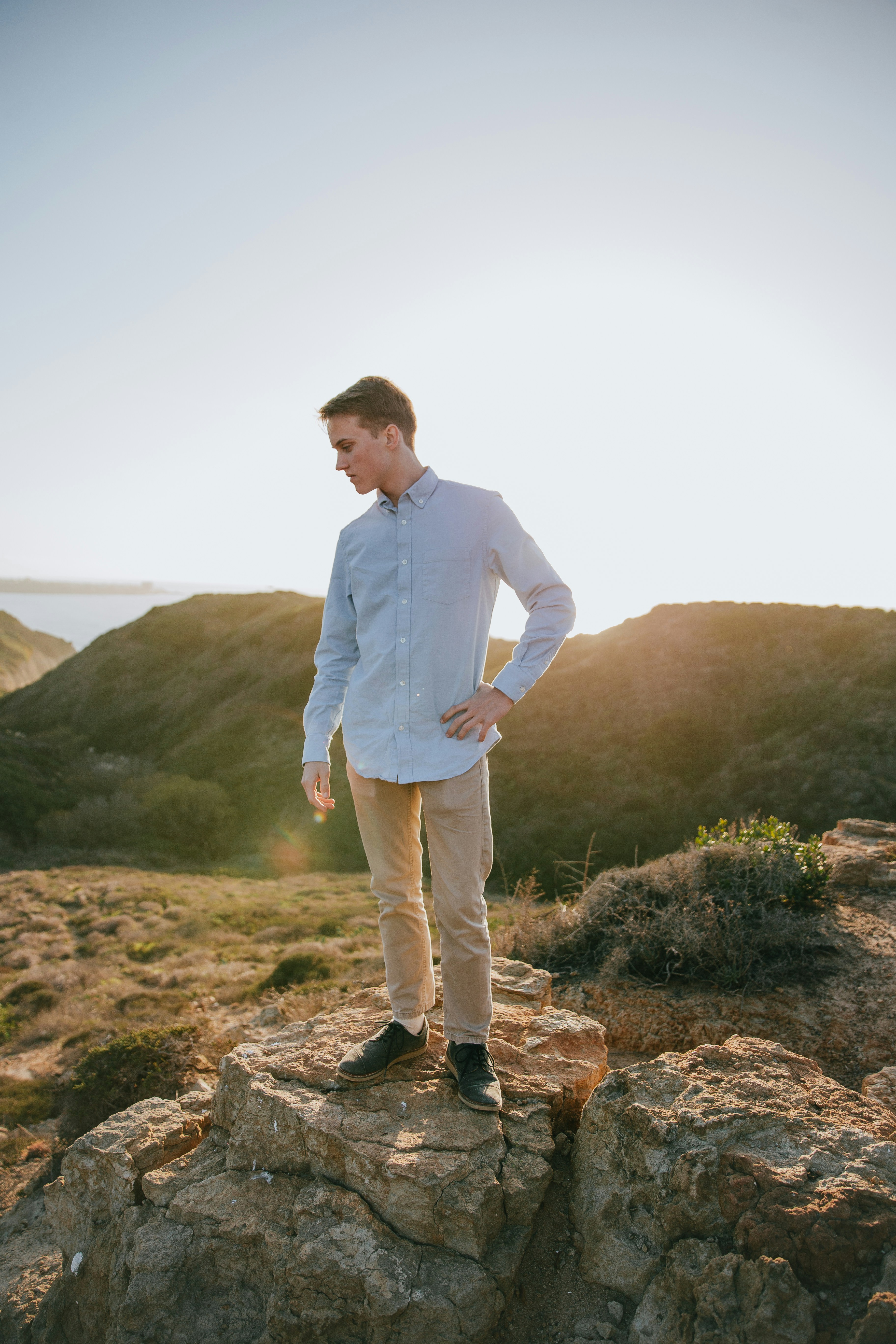 Man standing on rock looking down during day photo – Free United states ...