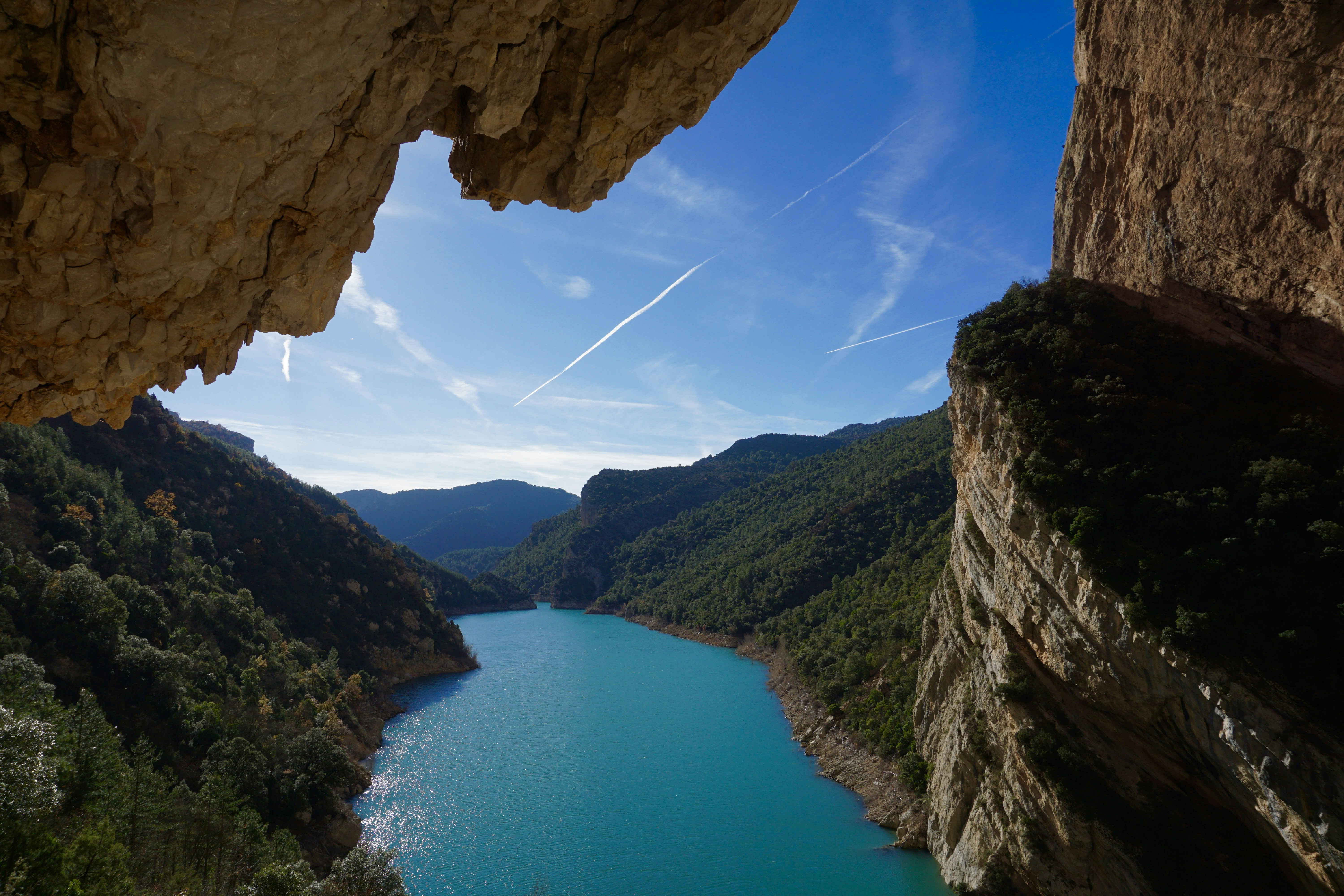 Azure Ribbon in a Limestone Gorge: River Between Massive Walls