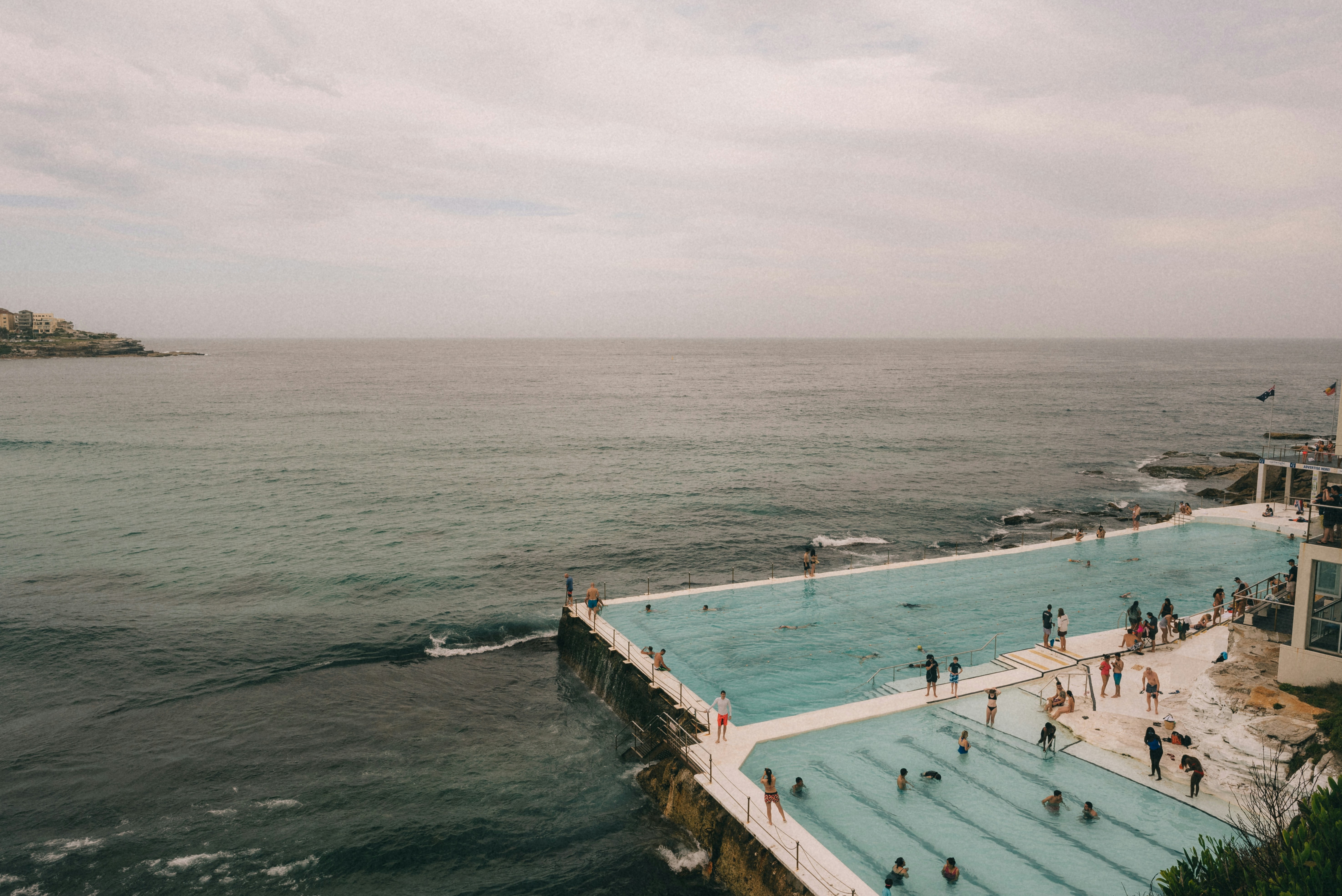 People on swimming pool beside sea photo – Free Analogue photography ...