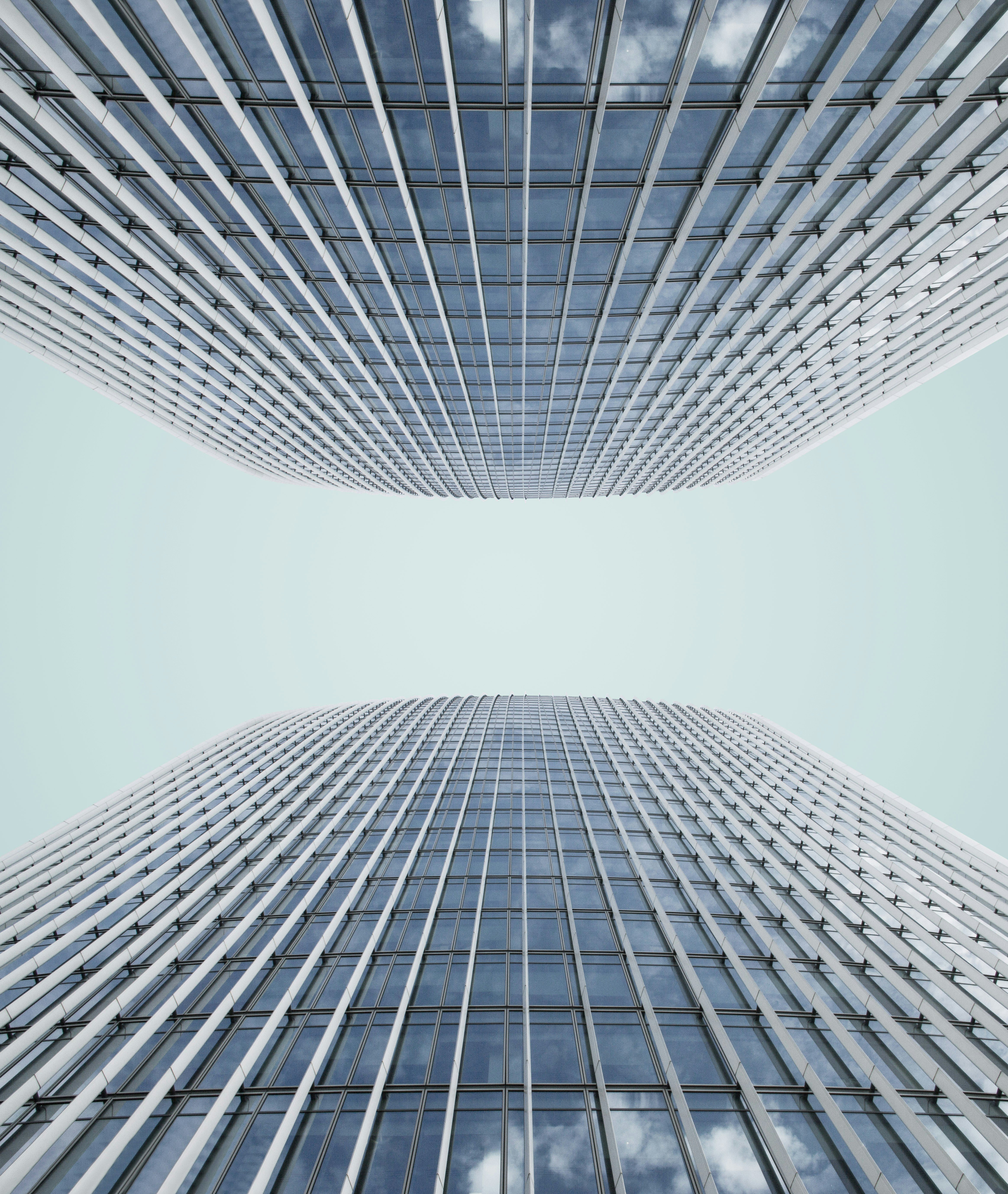 Low angle photo of high rise glass building at daytime photo – Free ...