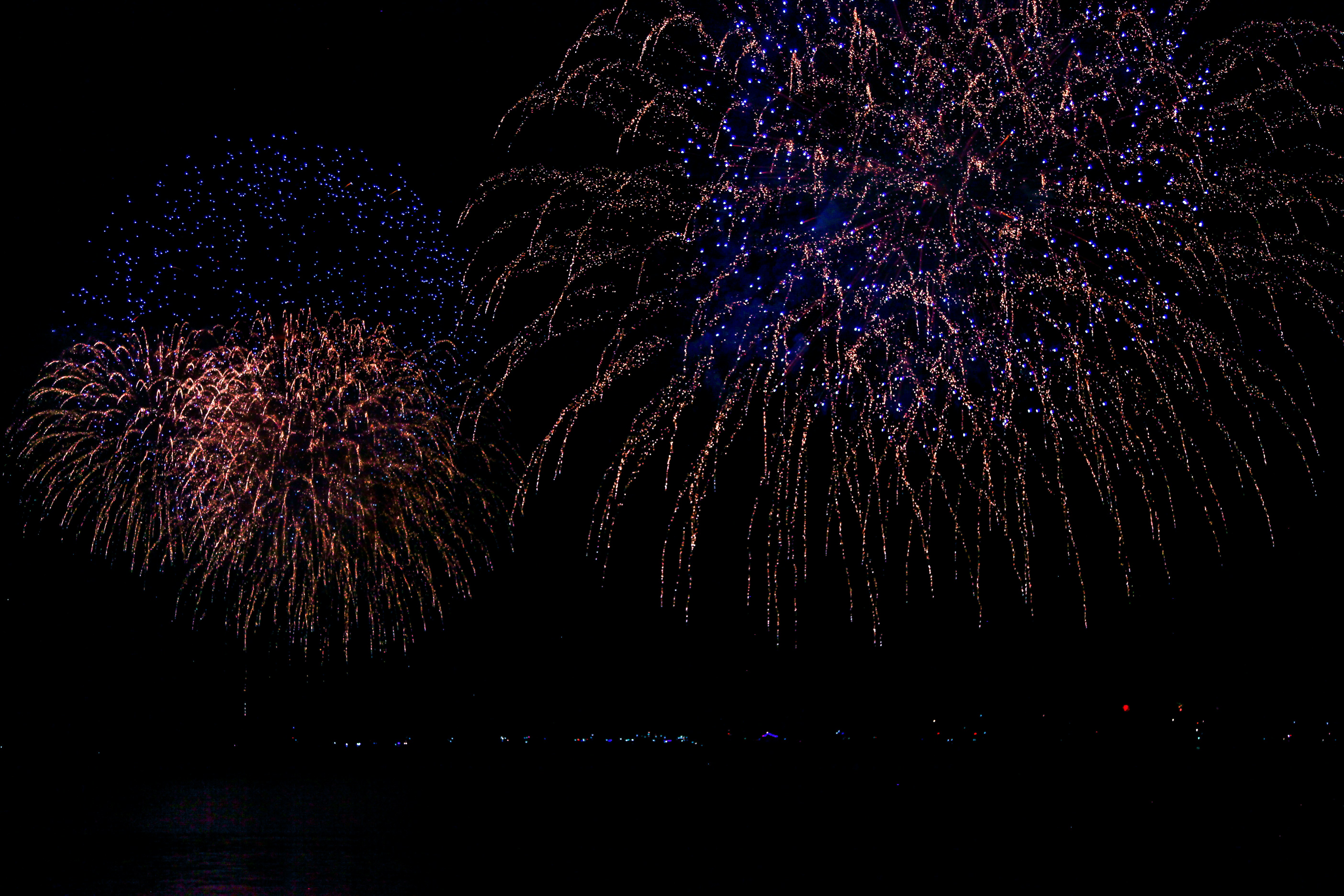 Time-lapse photography of bursting fireworks in sky during nighttime ...