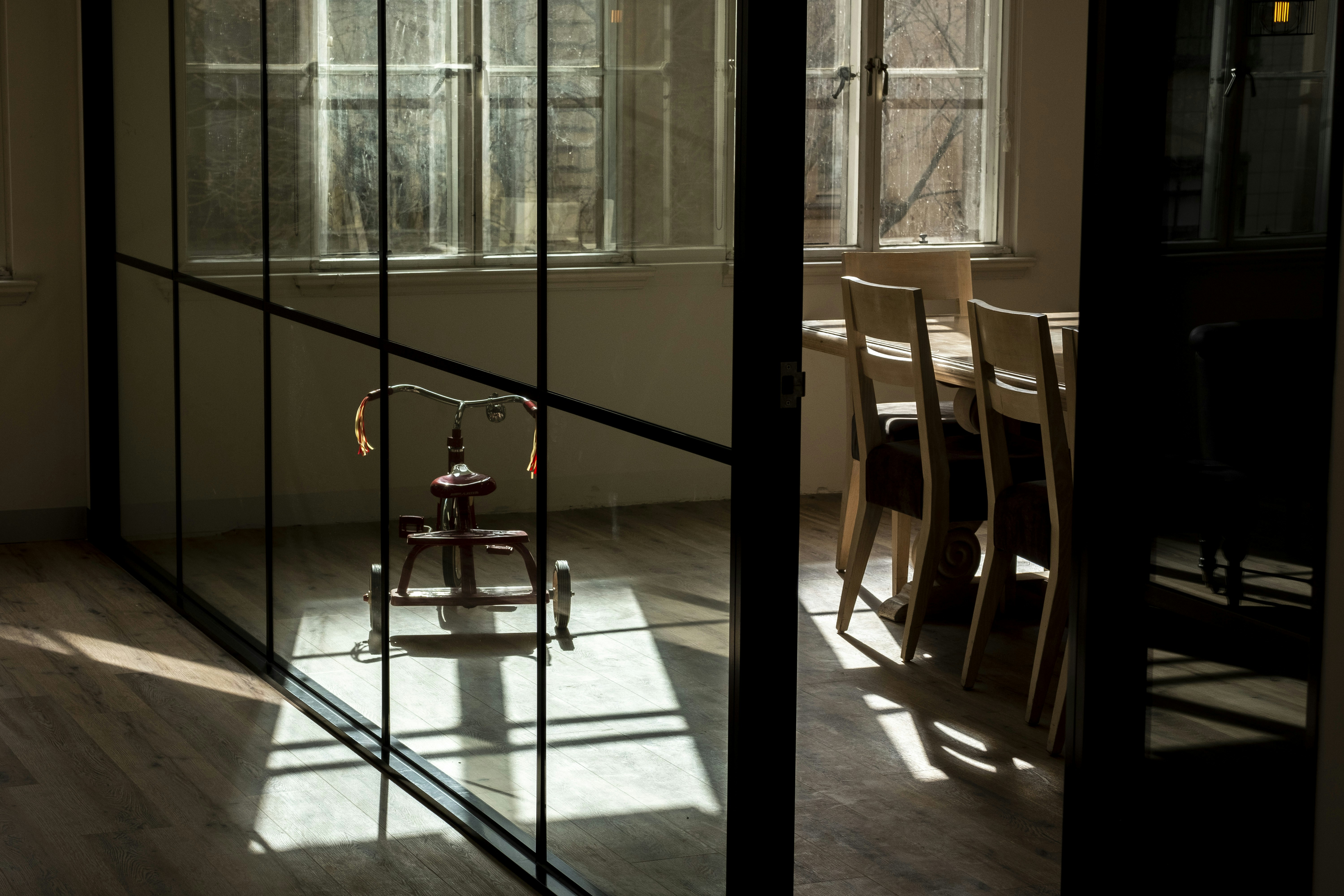 Brown trike facing window photo – Free Tricycle Image on Unsplash