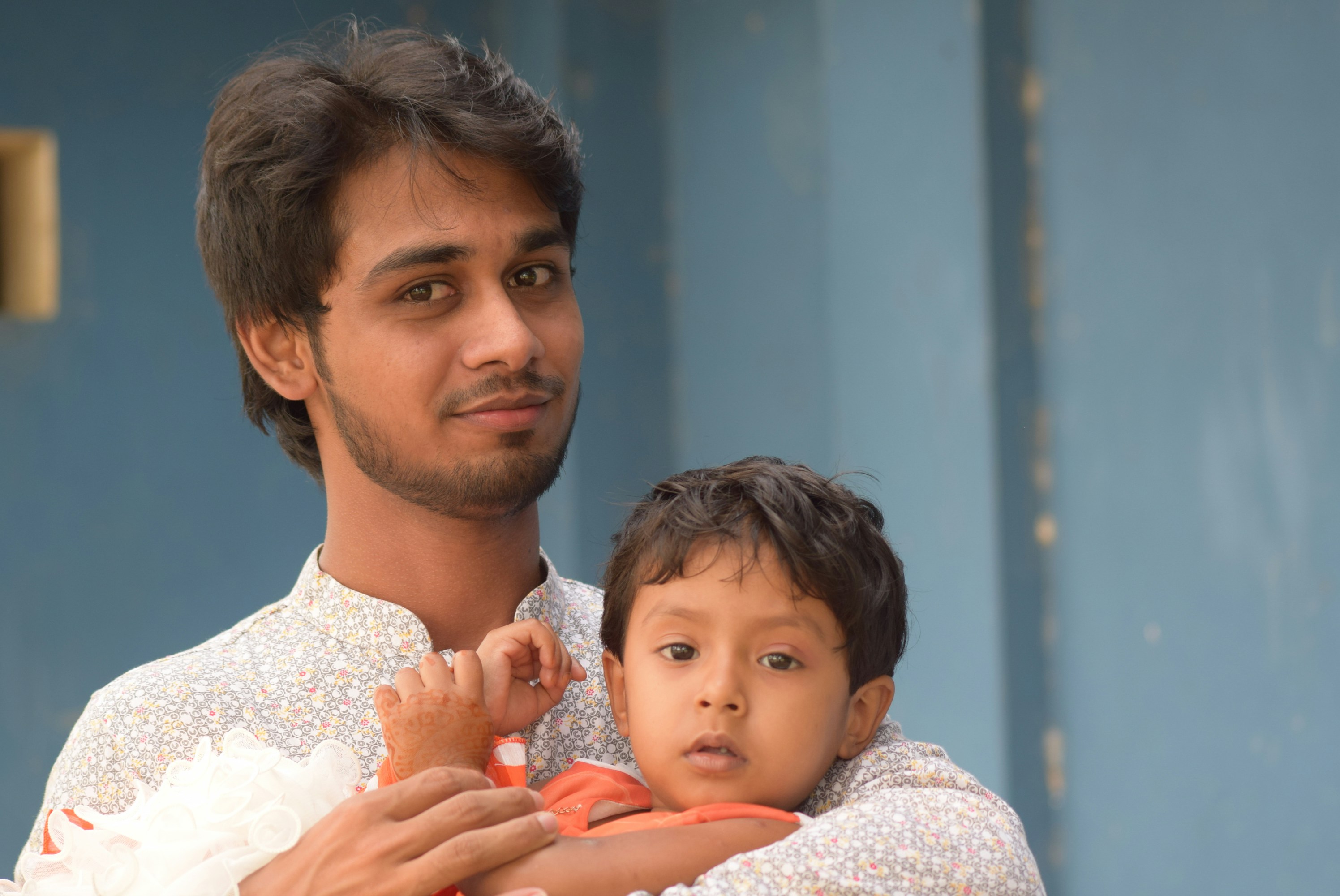 Man carrying boy photo – Free Grey Image on Unsplash