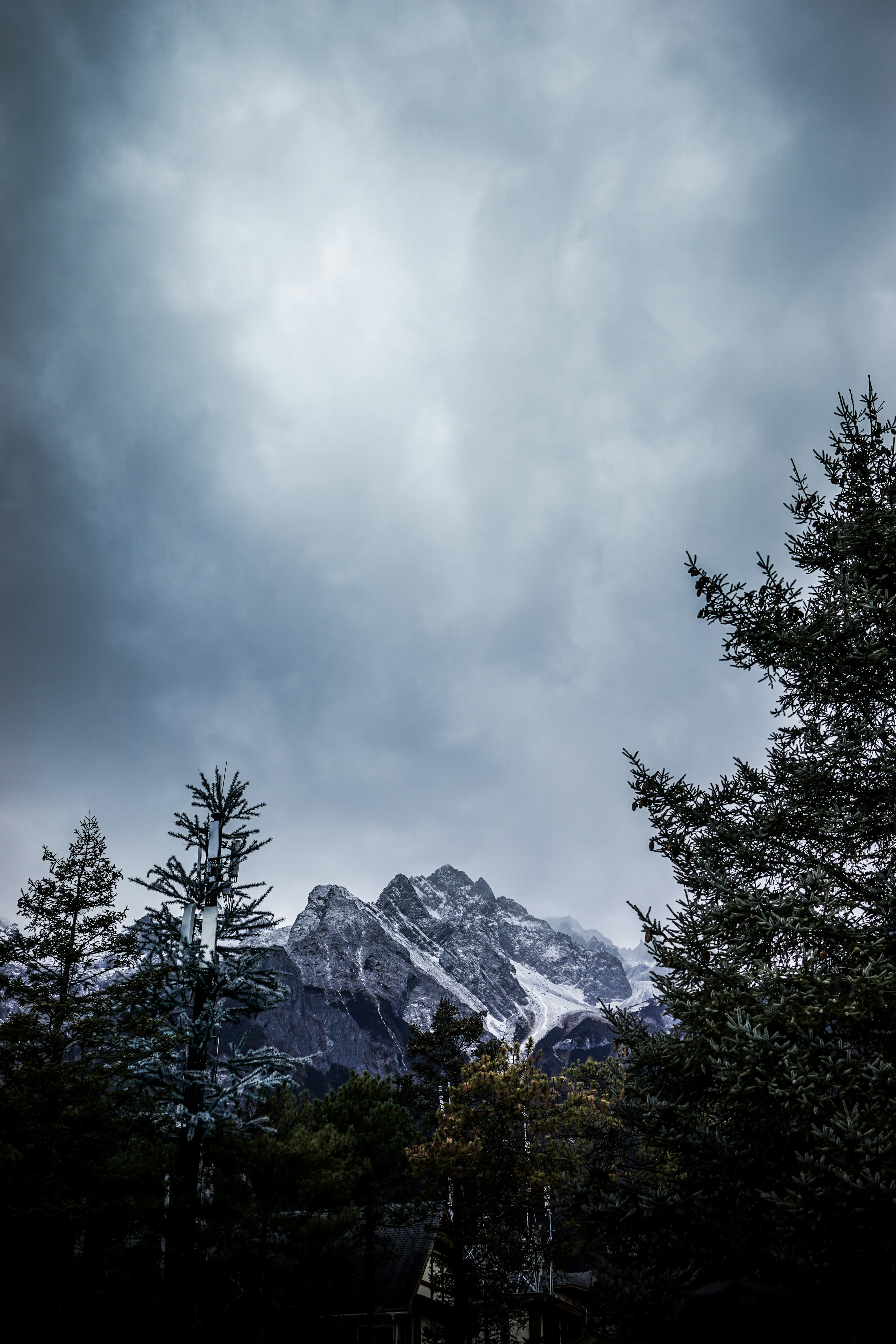 Snow covered mountain under gray sky at daytime photo – Free Cloudy ...