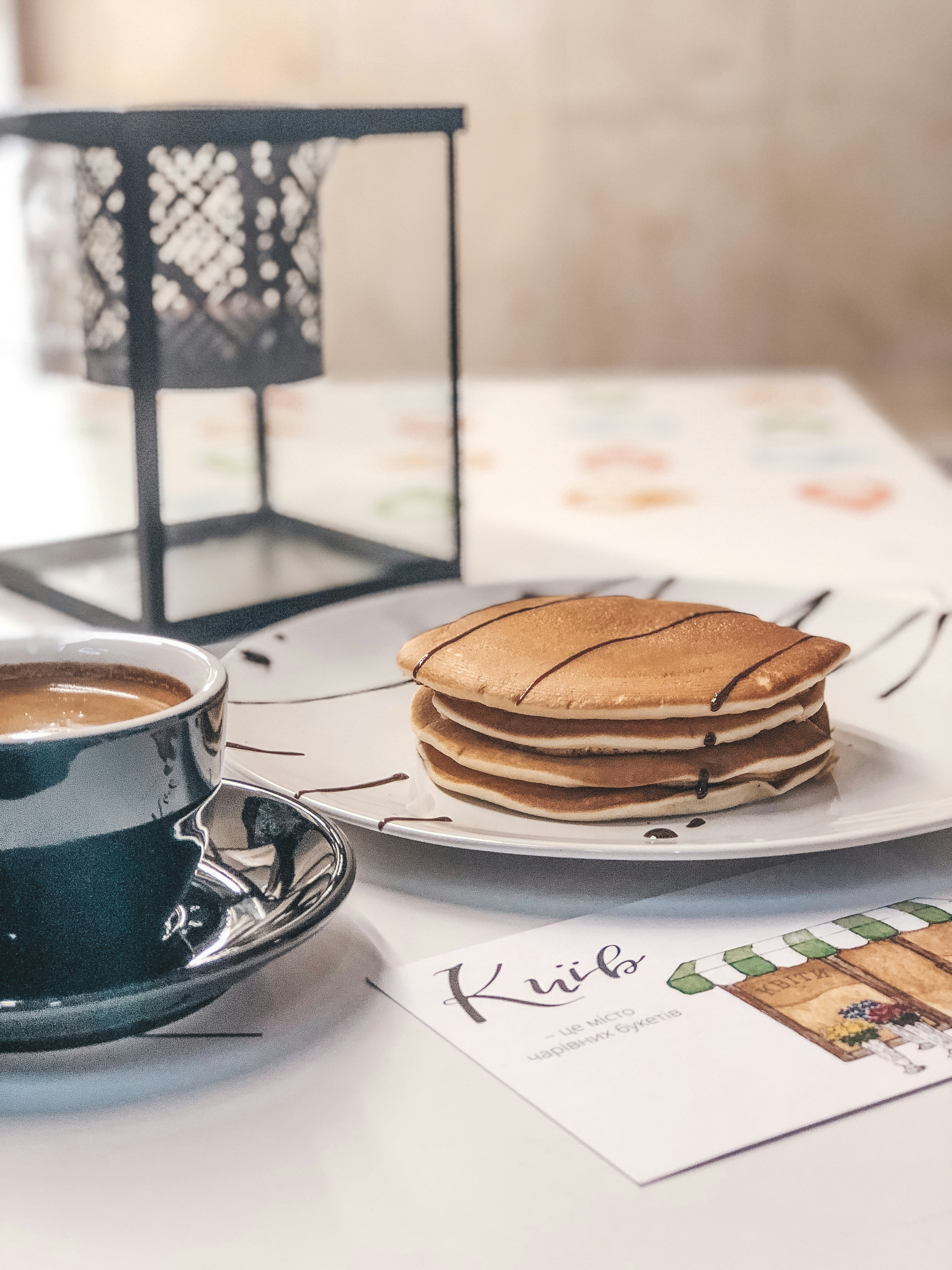 Cafe Morning: Pancakes and a Latte Steady on a Quiet Table