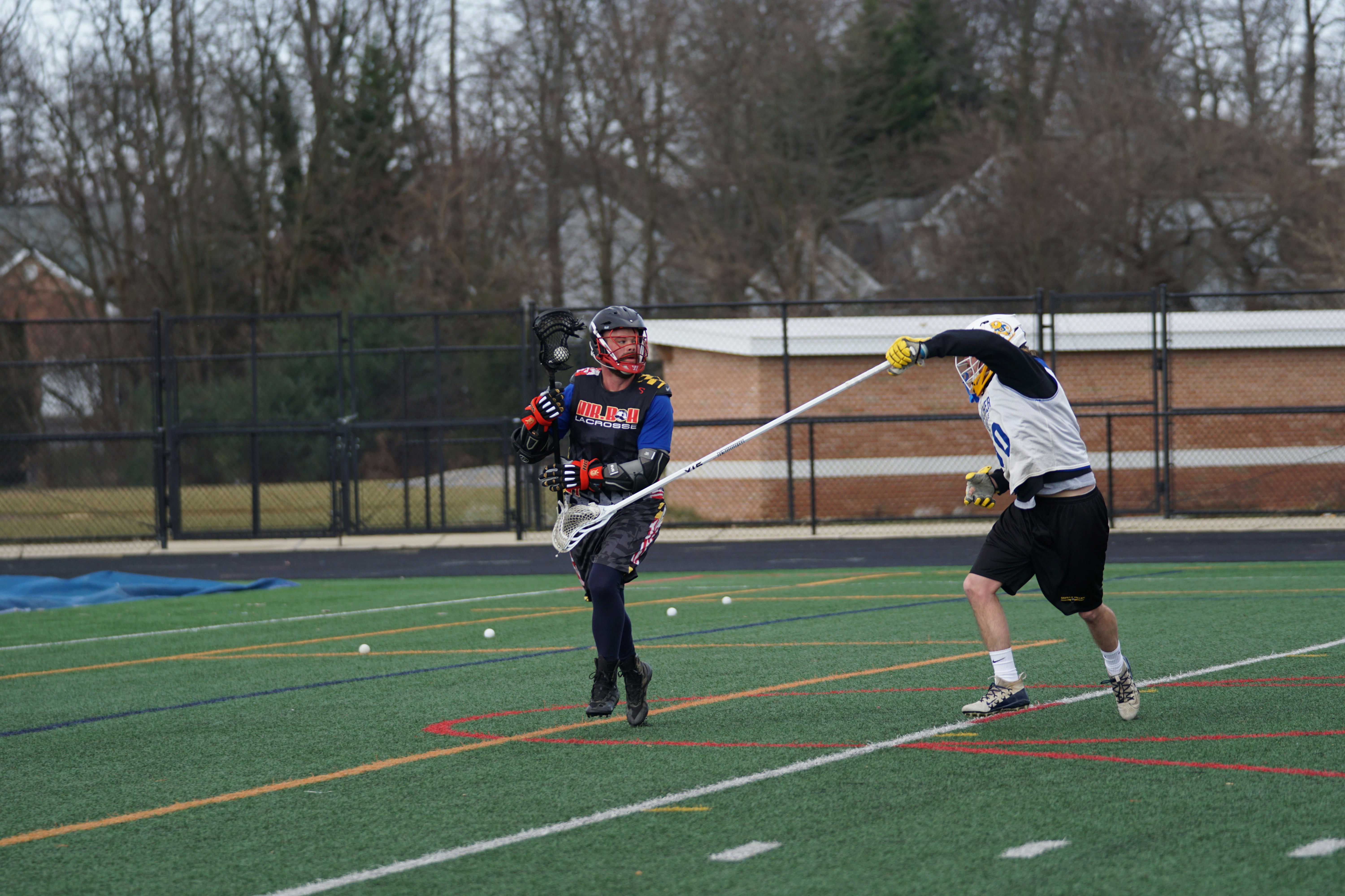 Two men playing lacrosse on green field photo – Free Human Image on ...