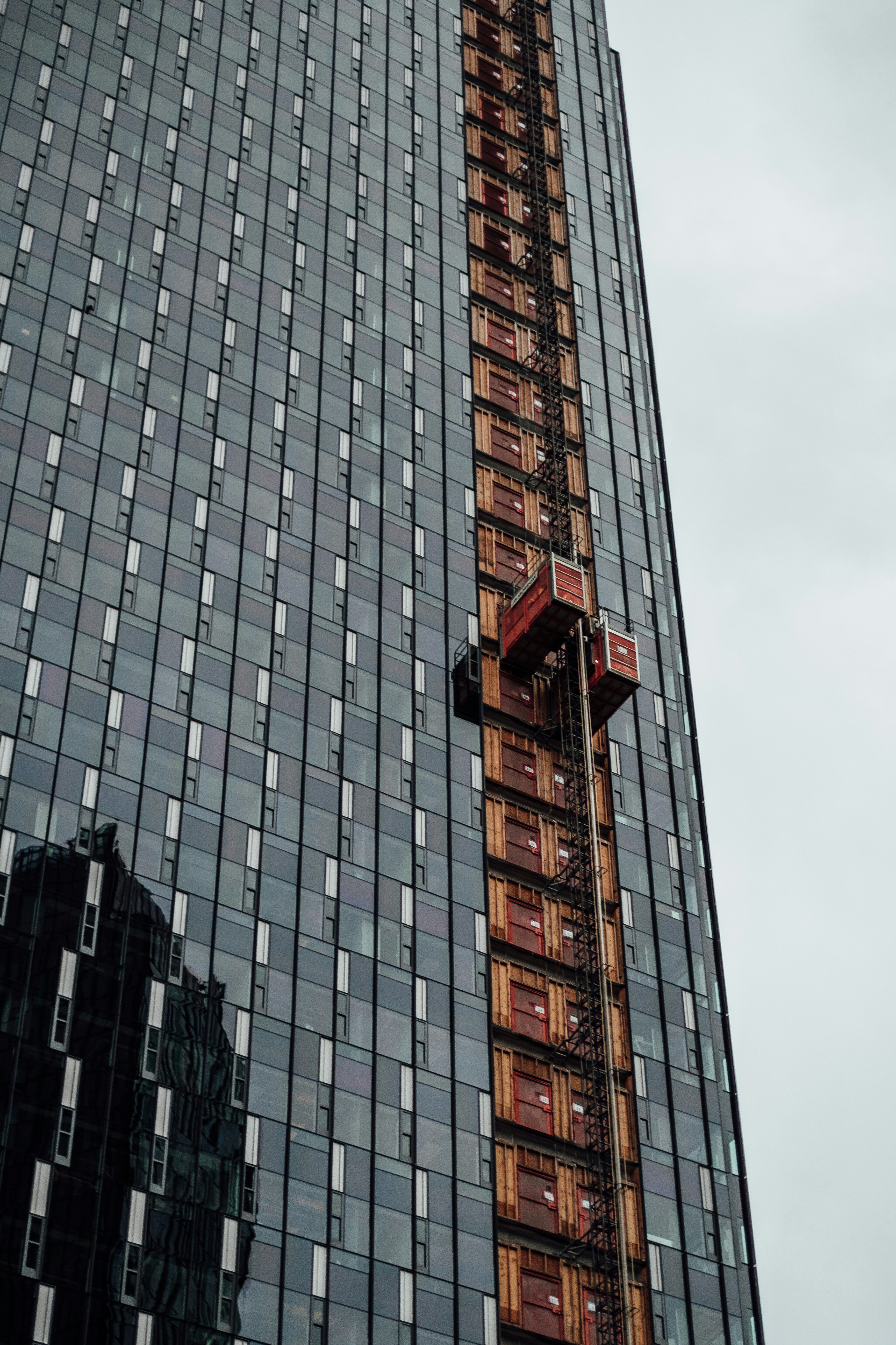 Brown elevator on side of high rise building photo – Free Wallpaper ...