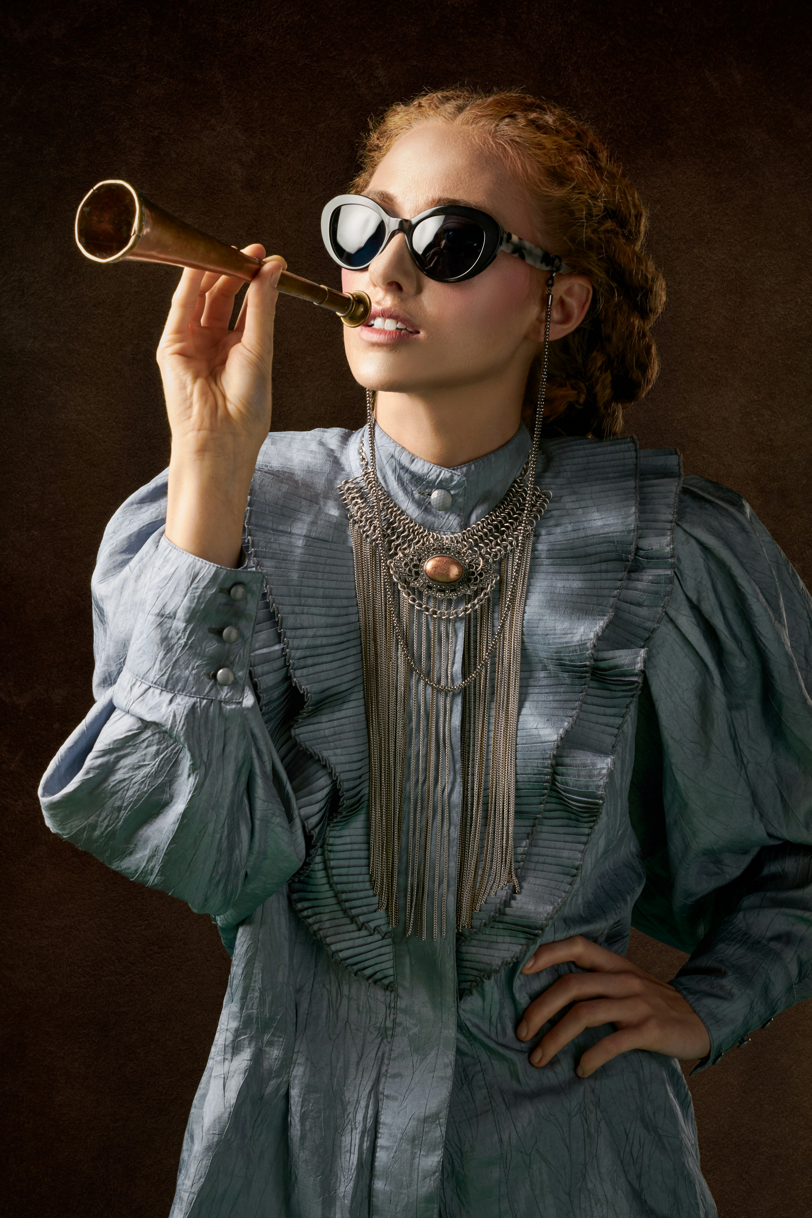 Model adorned in a vintage-inspired outfit, holding a brass horn, exuding an air of sophistication and nostalgia.