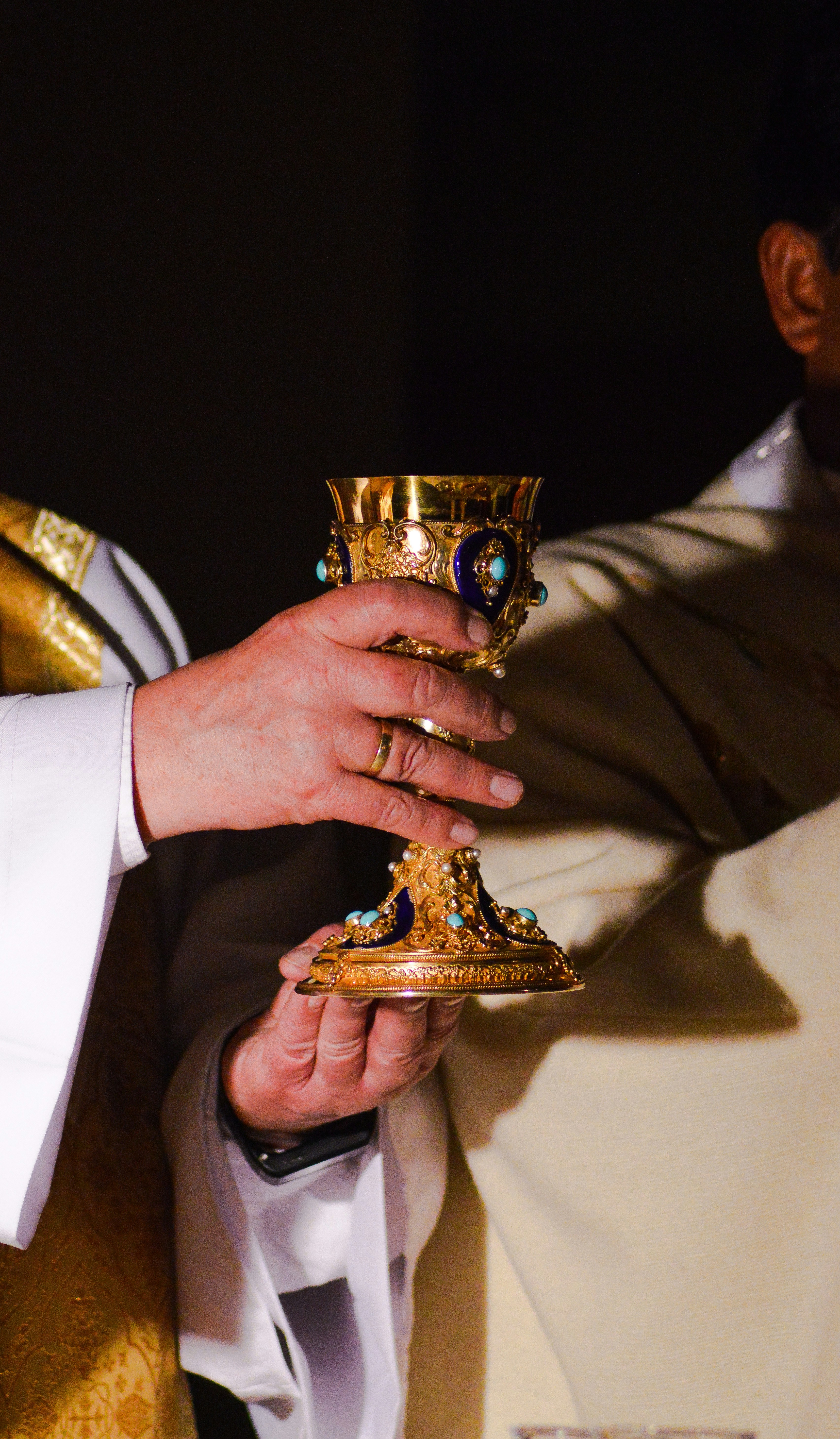 Chalice in Quiet Light: A Jewelled Vessel in Hand