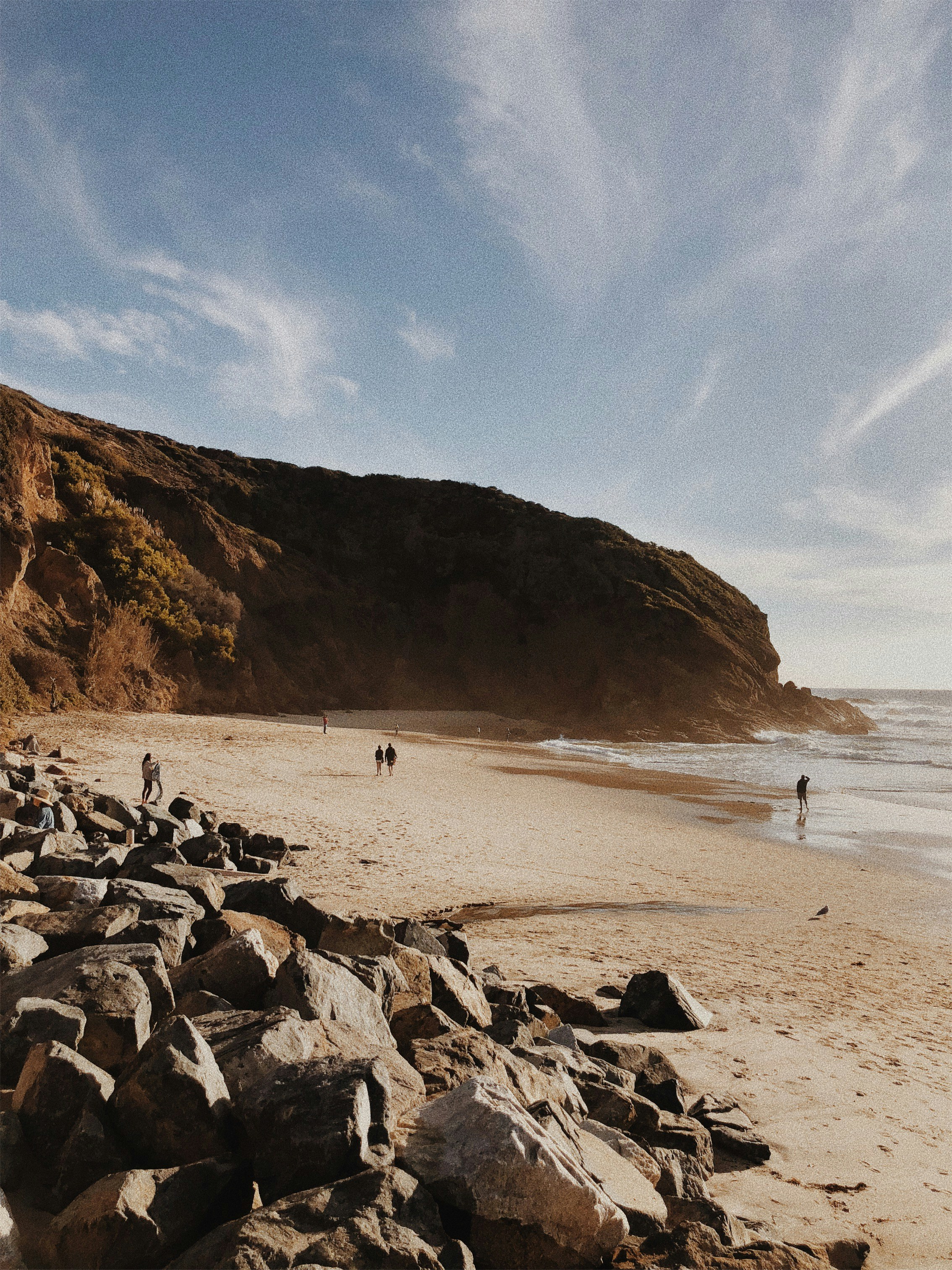 gray rocks beside seashores across mountain