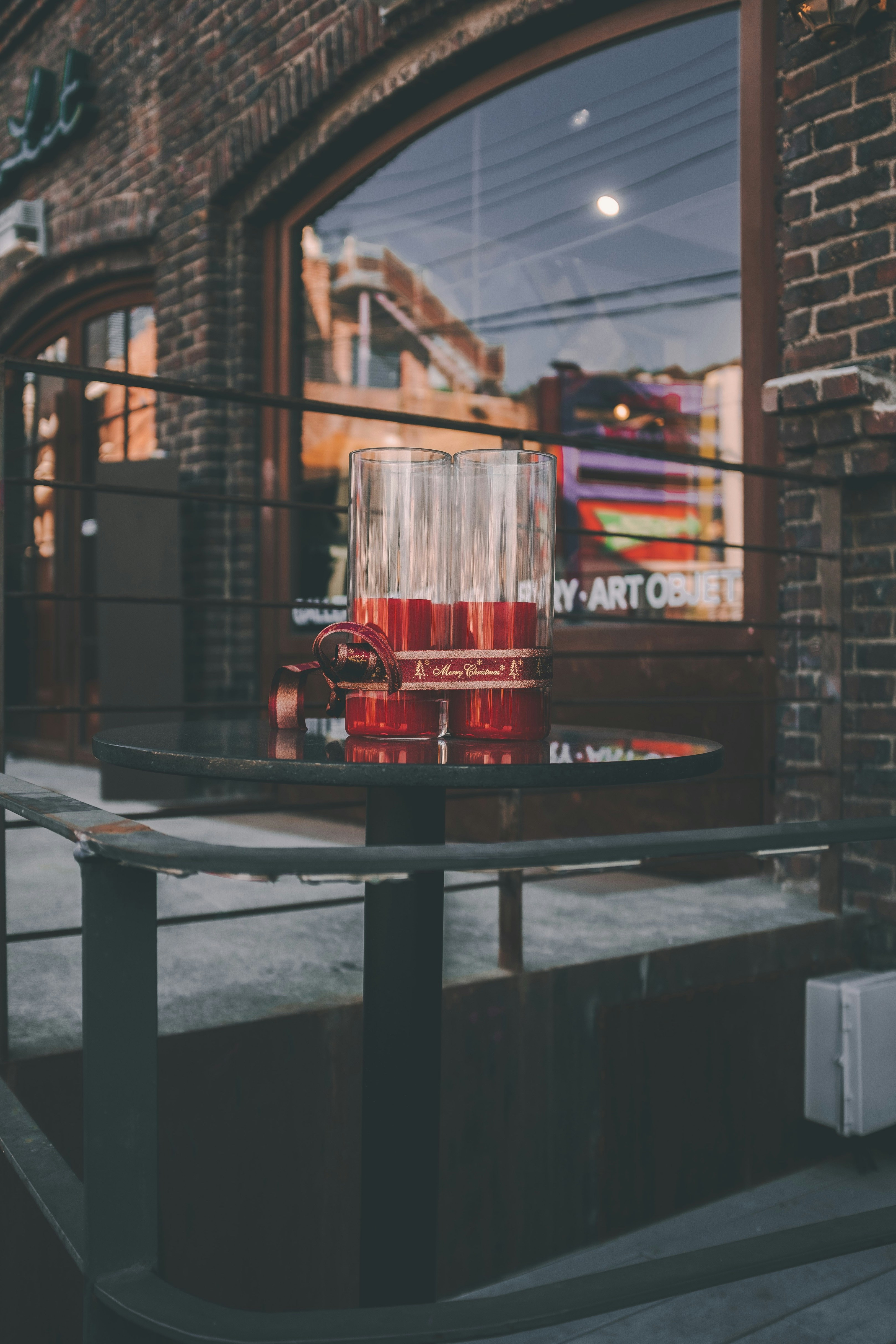clear drinking lass near building