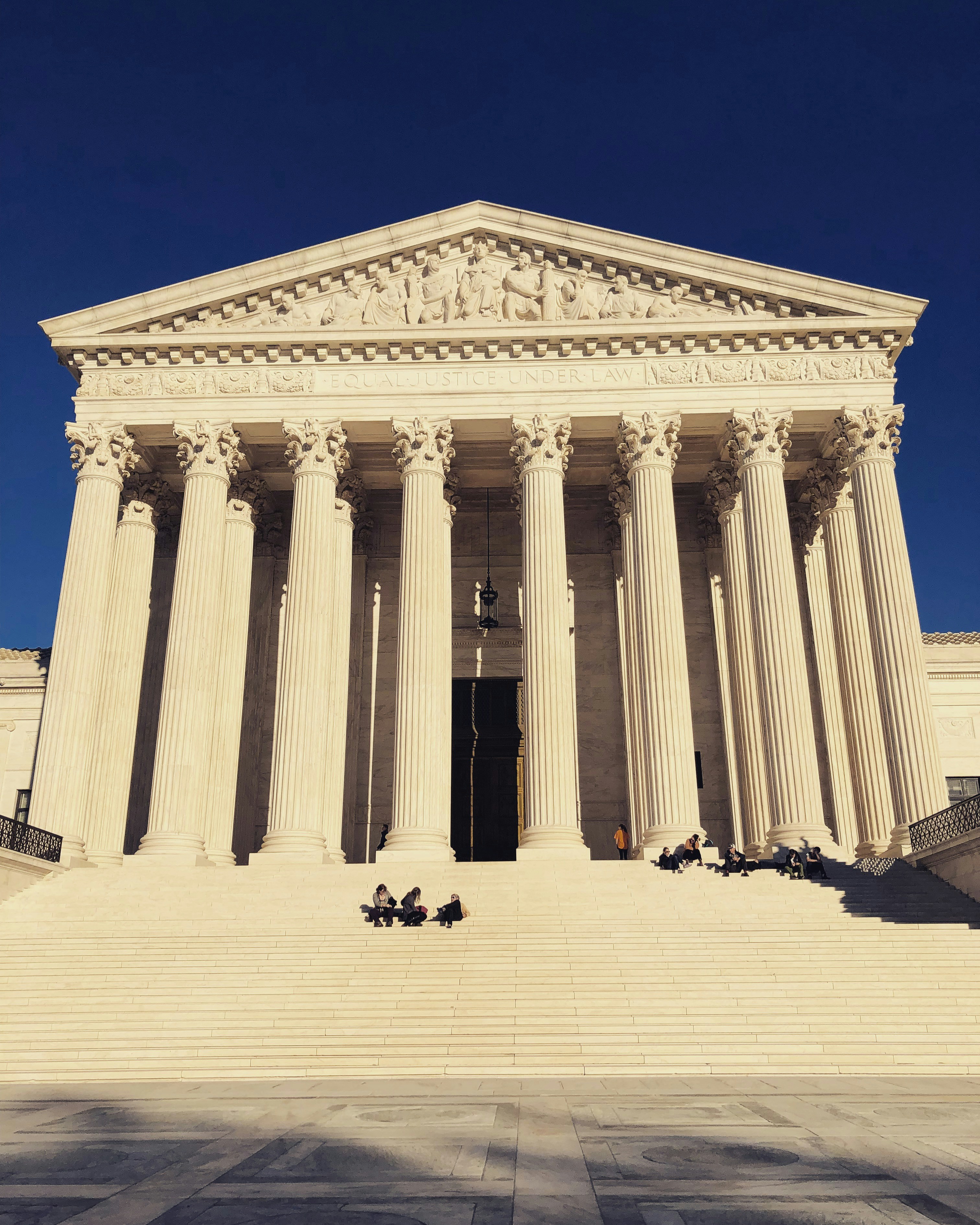 Symmetry in Stone: Centered Entrance Above a Grand Neoclassical Staircase