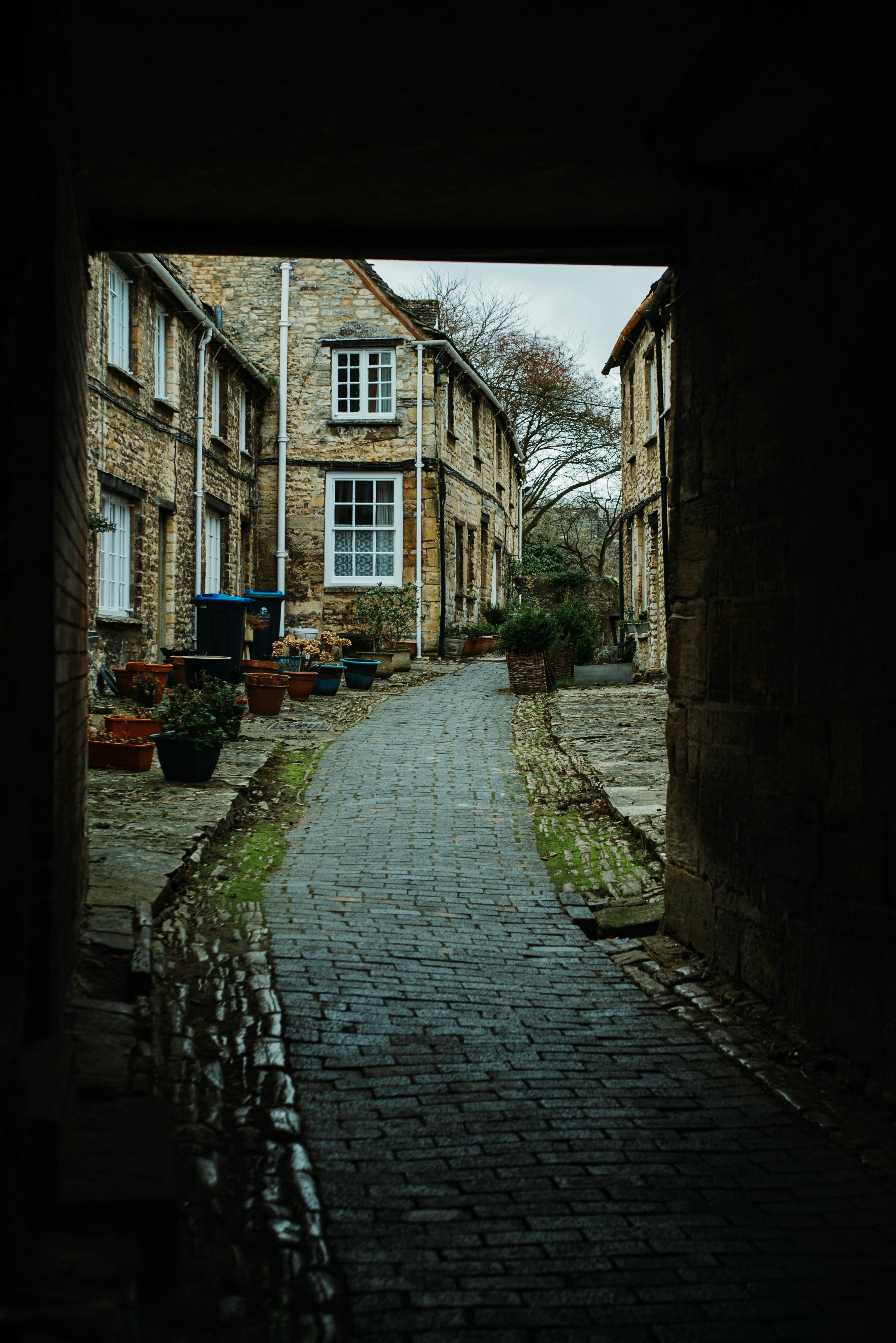 Brick pathway in between concrete buildings photo – Free Burford Image ...