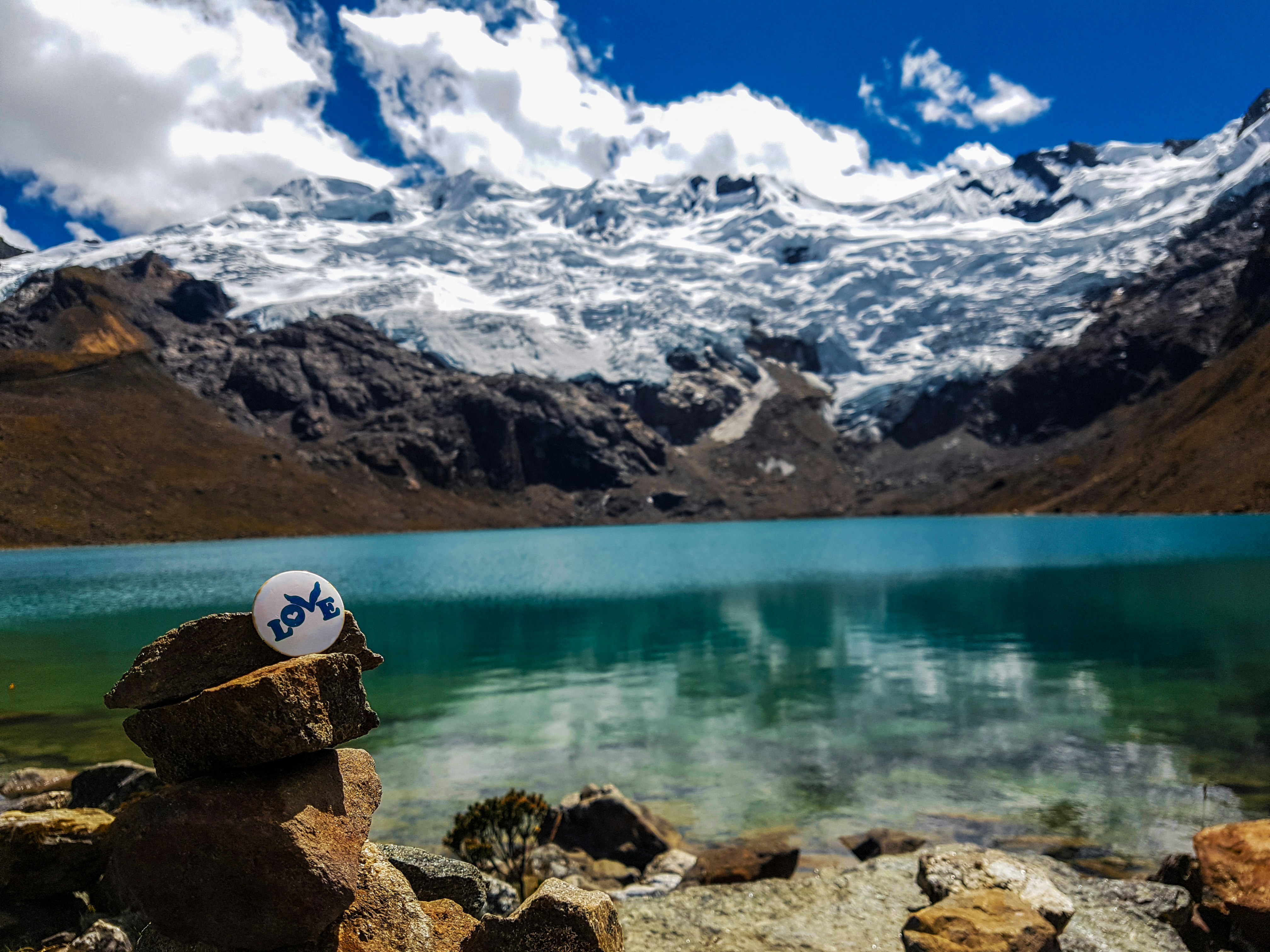 Turquoise Serenity Amidst Snow-Capped Peaks