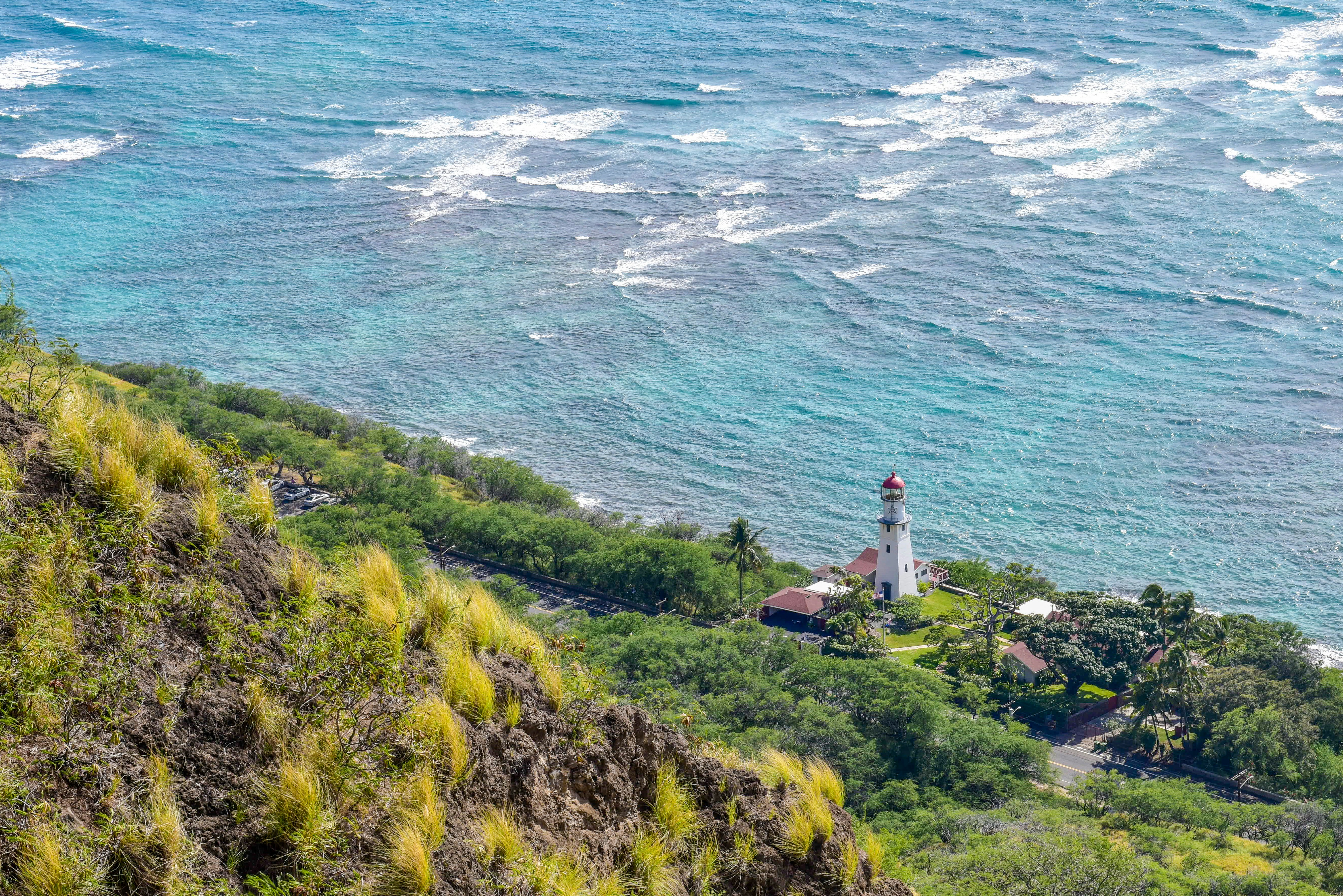 Cliffside Lighthouse Over Turquoise Seas and Emerald Cliffs