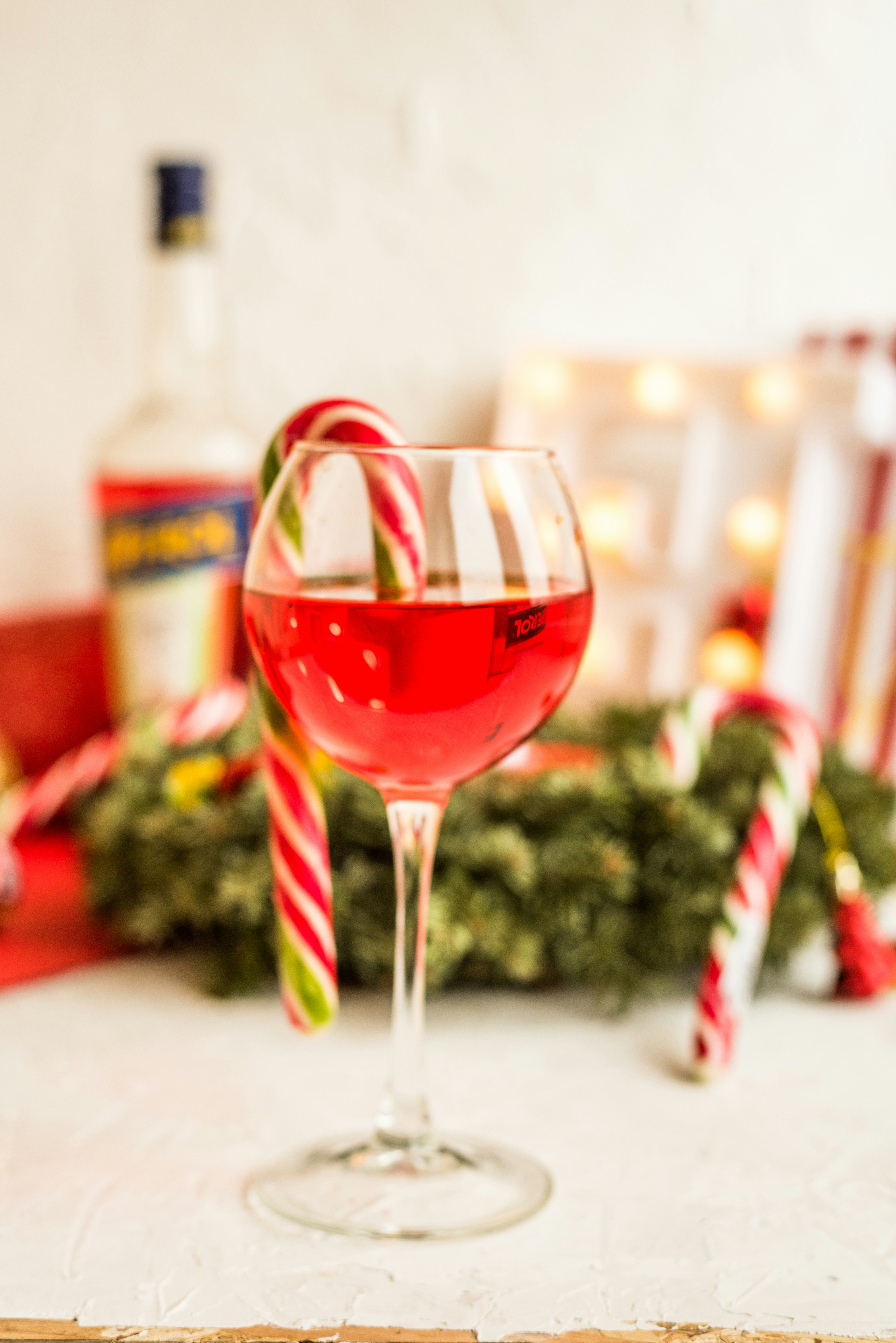Candy Cane cocktail glow: red festive spritz in a crystal glass